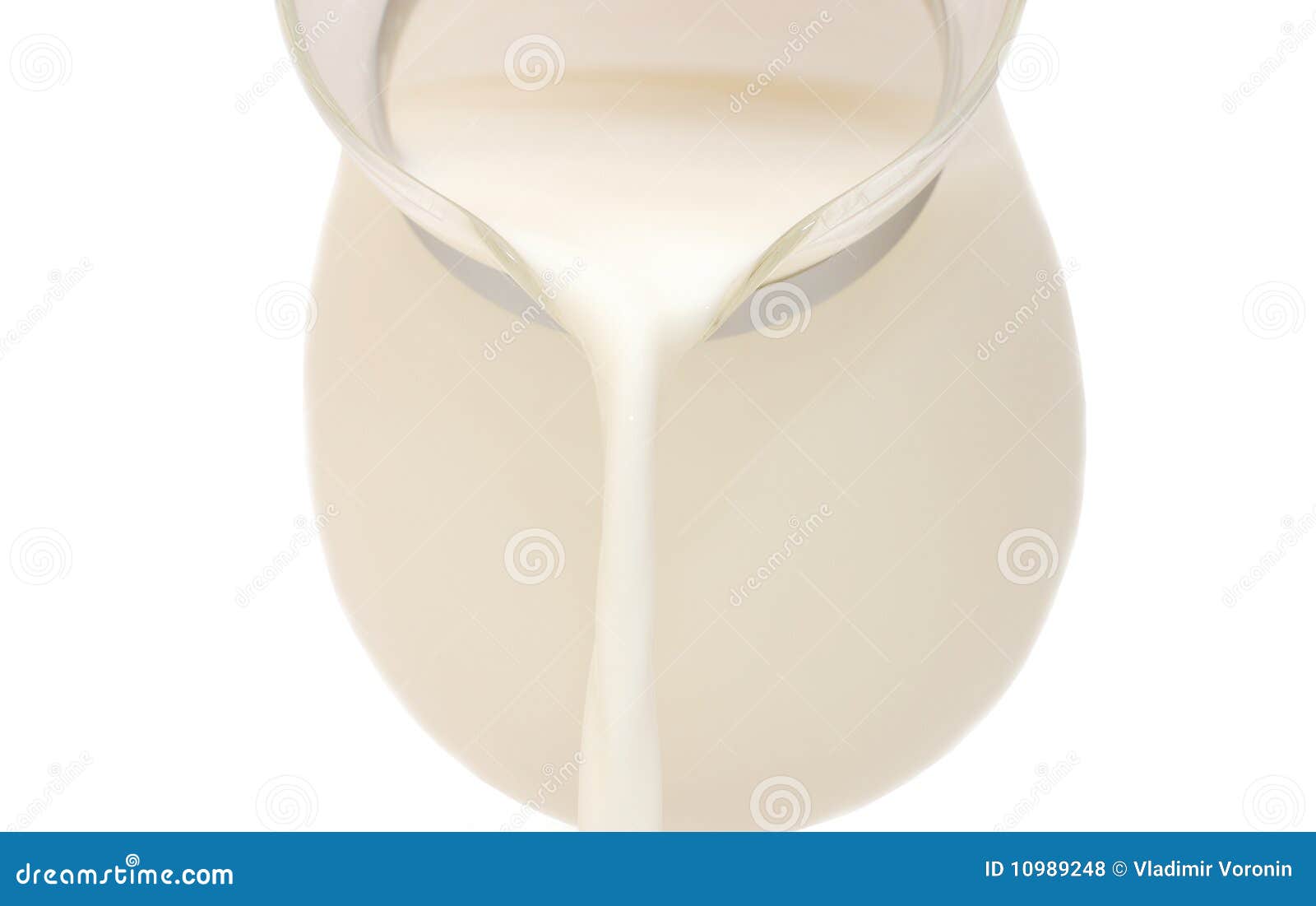 Pouring of milk from a jug stock photo. Image of motion - 10989248