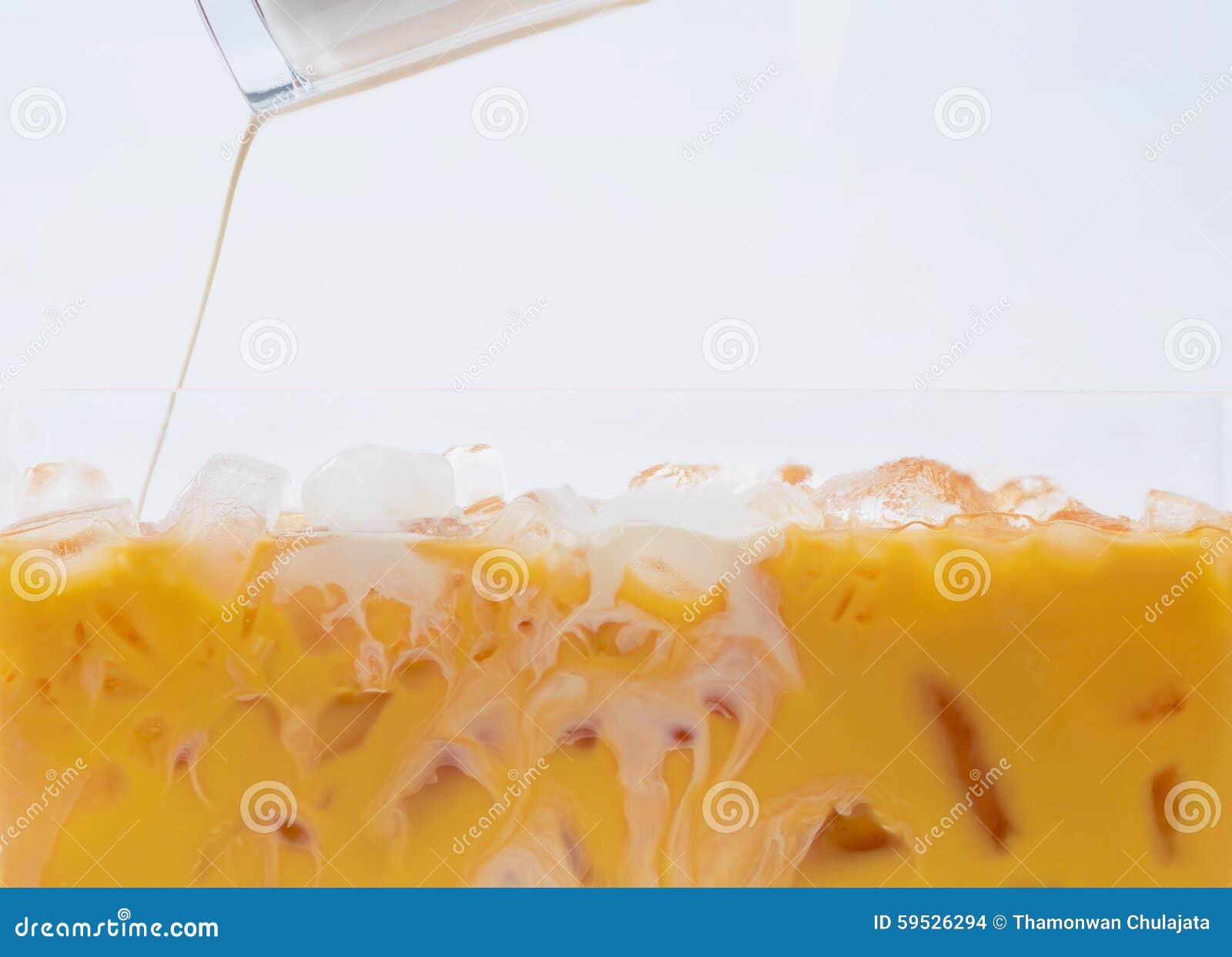 Pouring milk to iced tea stock photo. Image of drink - 59526294