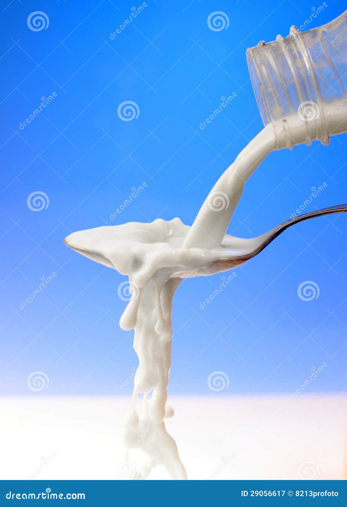 Pouring milk to the spoon stock image. Image of cold - 29056617