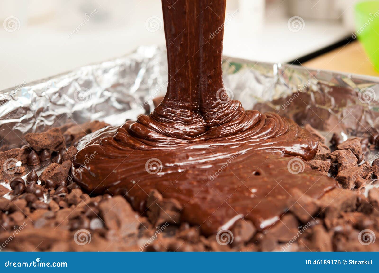 Pouring Mixture of Chocolate Eggs and Flour Stock Photo - Image of ...