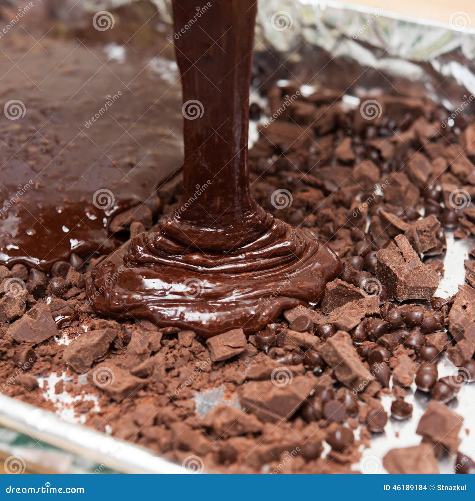Pouring Mixture of Chocolate Eggs and Flour Stock Photo - Image of ...
