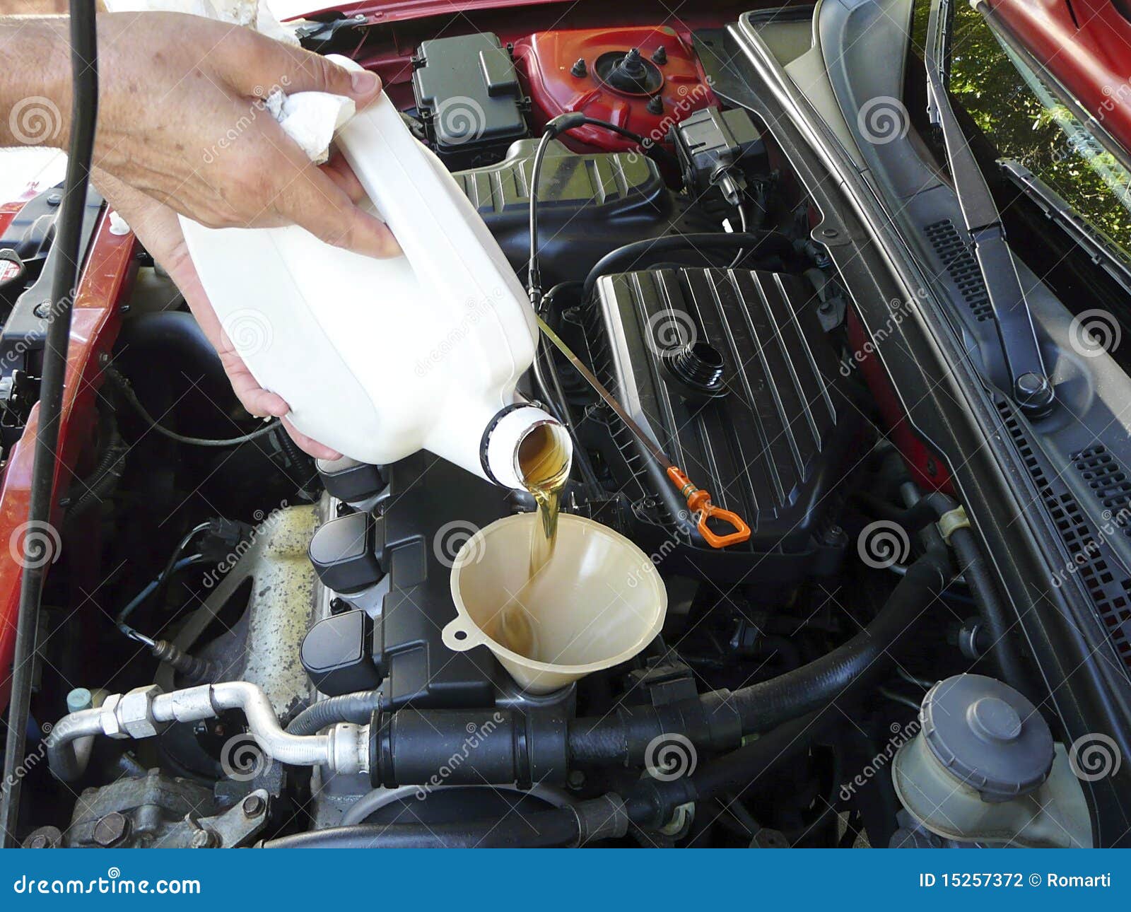 Pouring Motor Oil stock photo. Image of engine, hand - 15257372