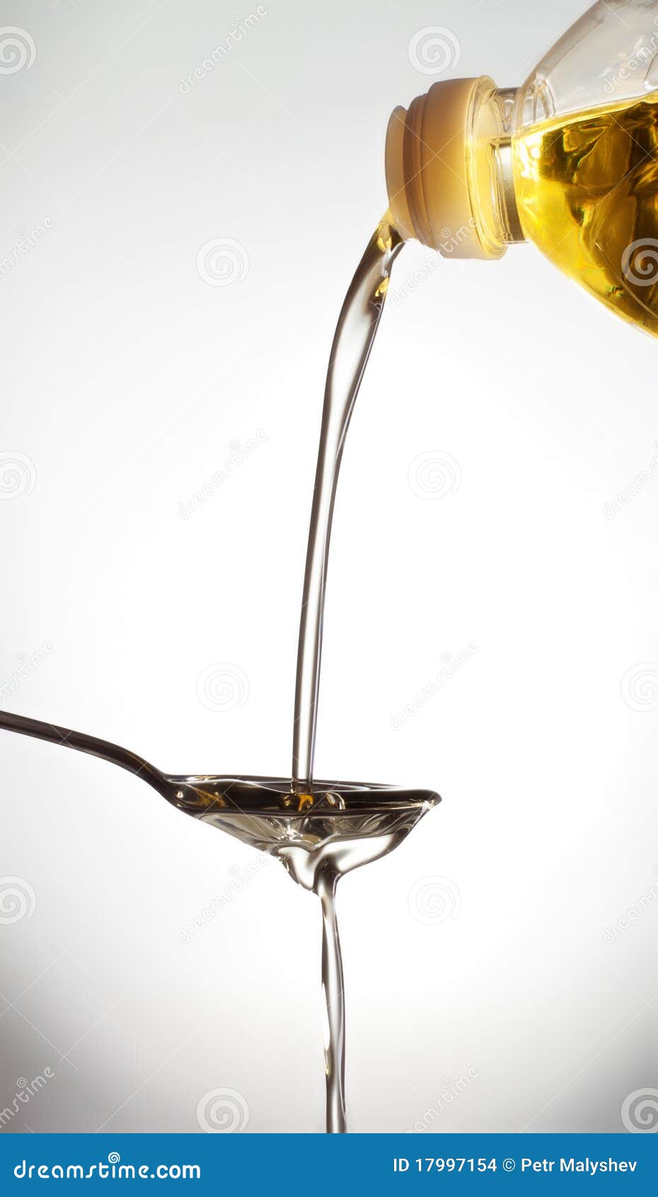 Pouring oil stock photo. Image of drop, drip, pour, yellow - 17997154