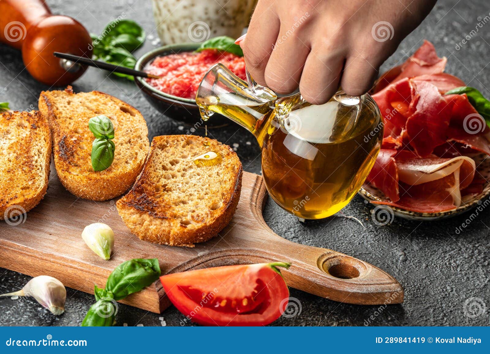 Pouring Oil on Toast with Ham and Tomato. Spanish Breakfast Stock Image ...