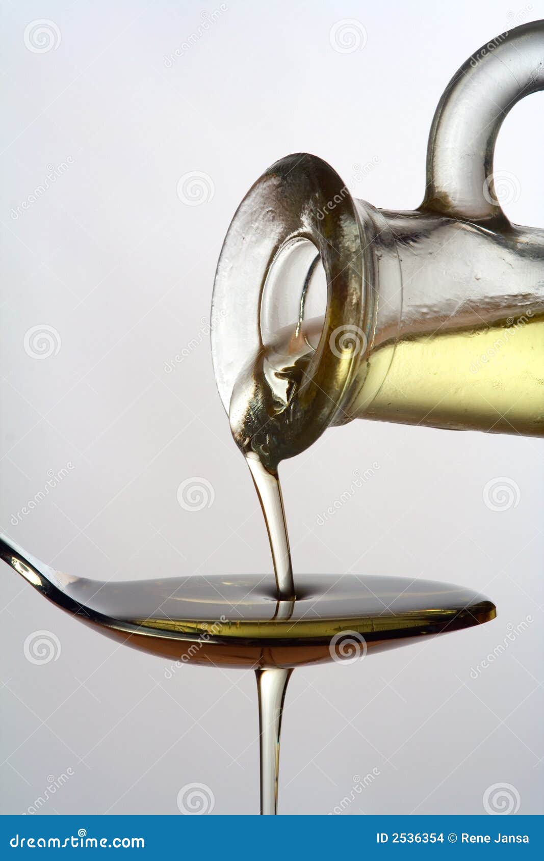 Pouring olive oil stock photo. Image of liquid, carafe - 2536354