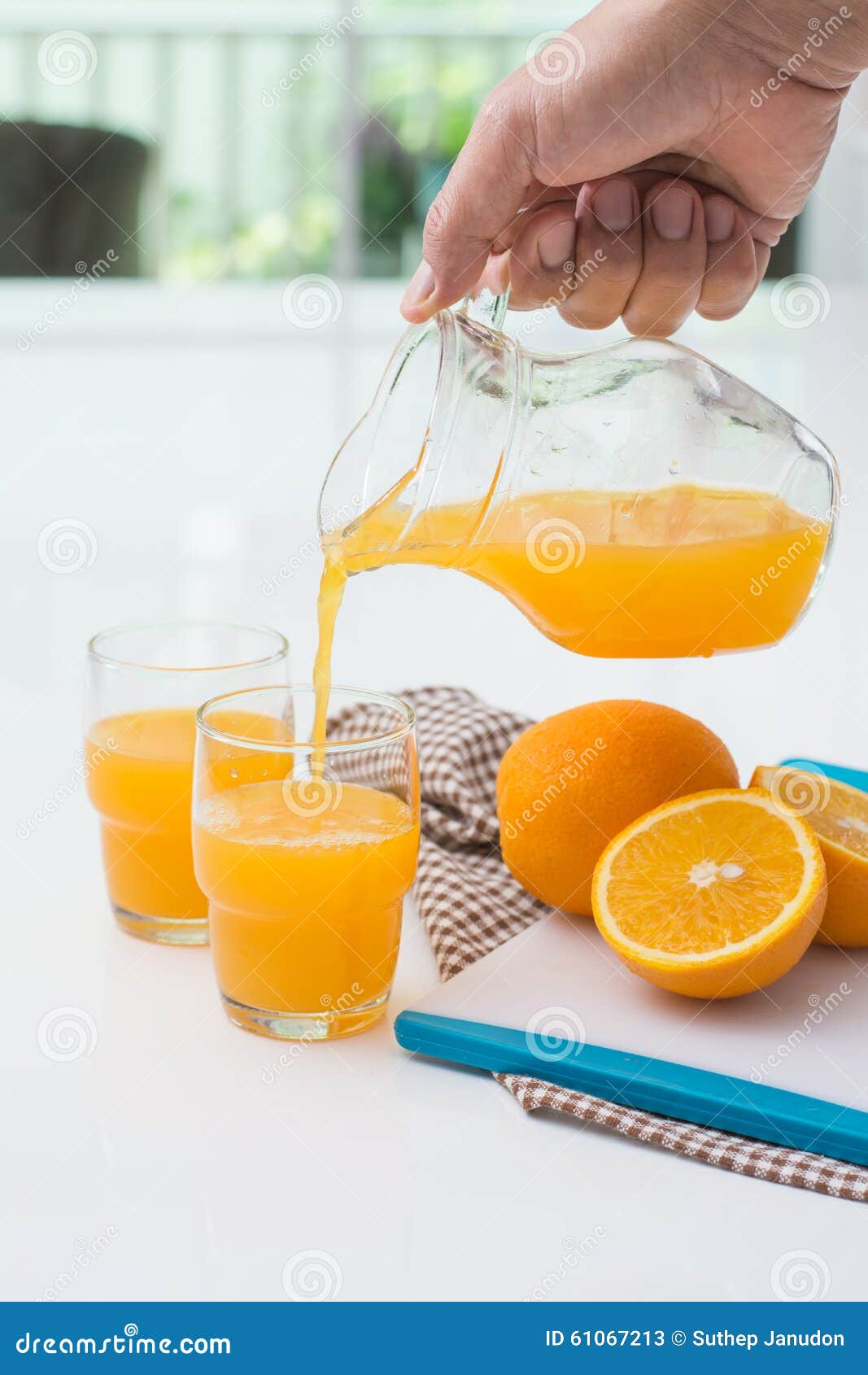 Pouring Orange Juice into the Glass Isolated on White Stock Image ...