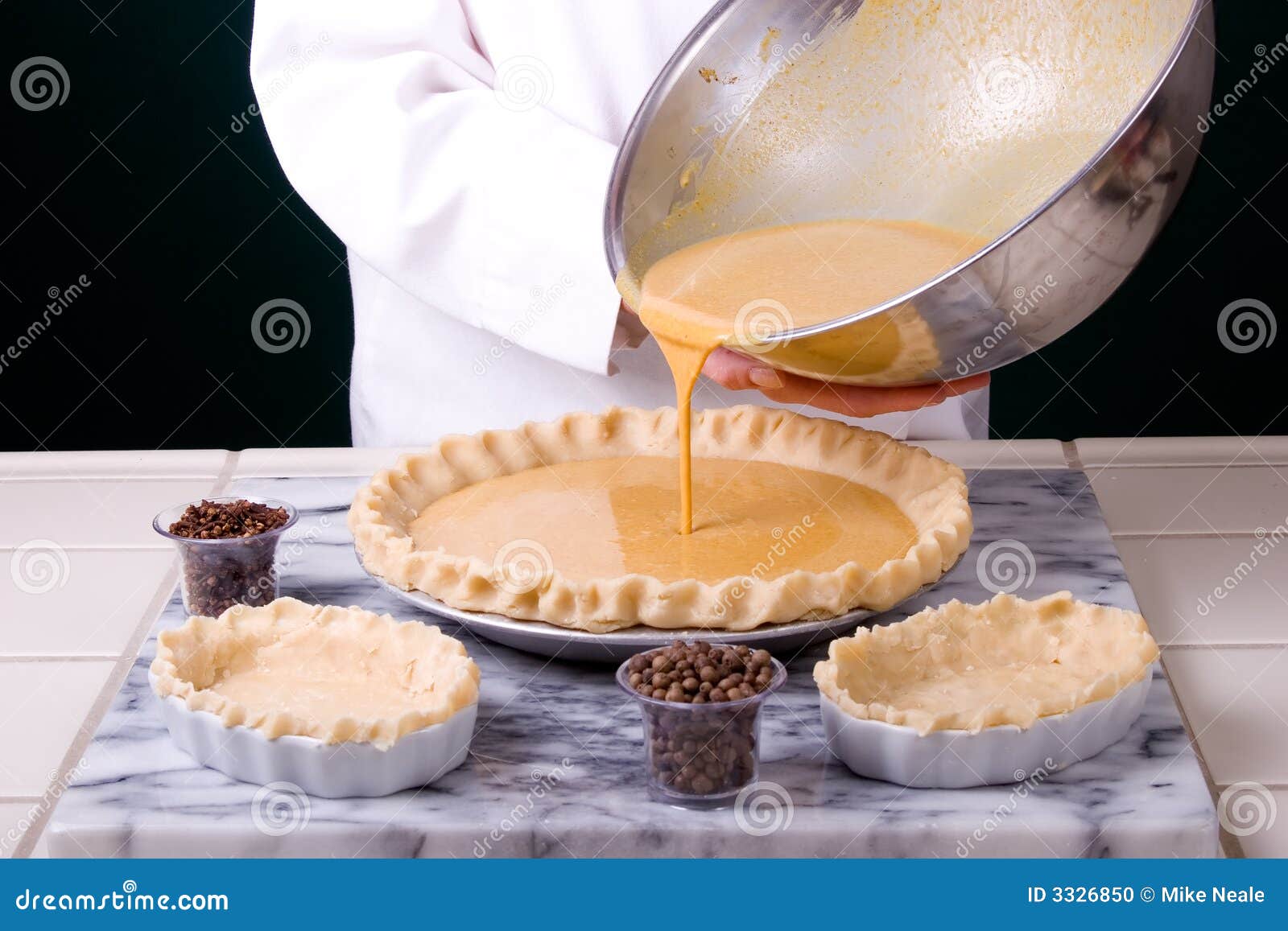 Pouring Pumpkin Batter stock photo. Image of chef, steel - 3326850
