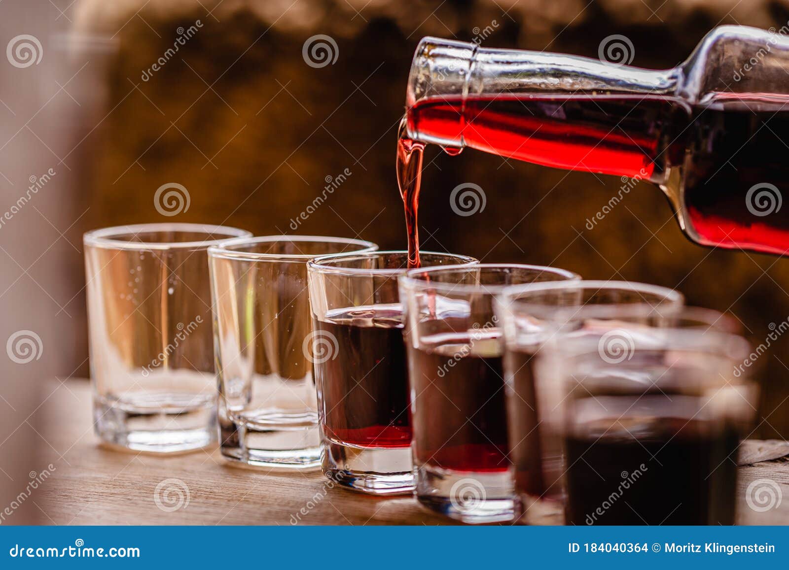 Pouring Red Alcohol Shots in Small Glasses on a Celebration Stock Photo ...