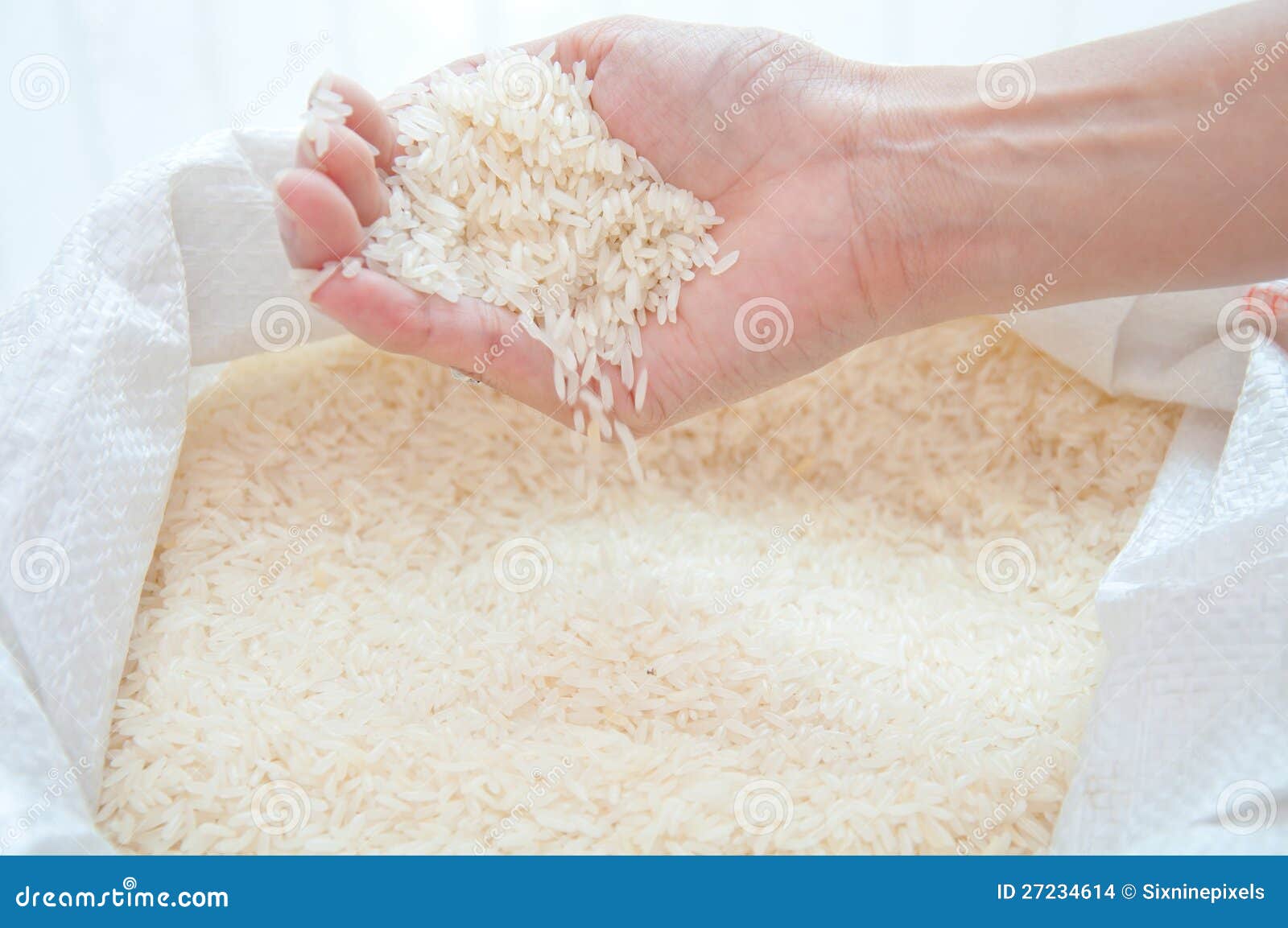 Pouring rice from hand stock photo. Image of macro, organic - 27234614