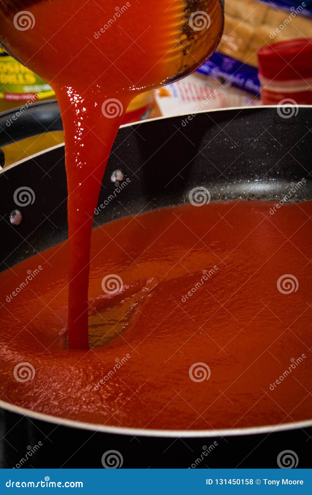 Pouring Sauce into Saucepan Stock Photo - Image of pepper, basil: 131450158
