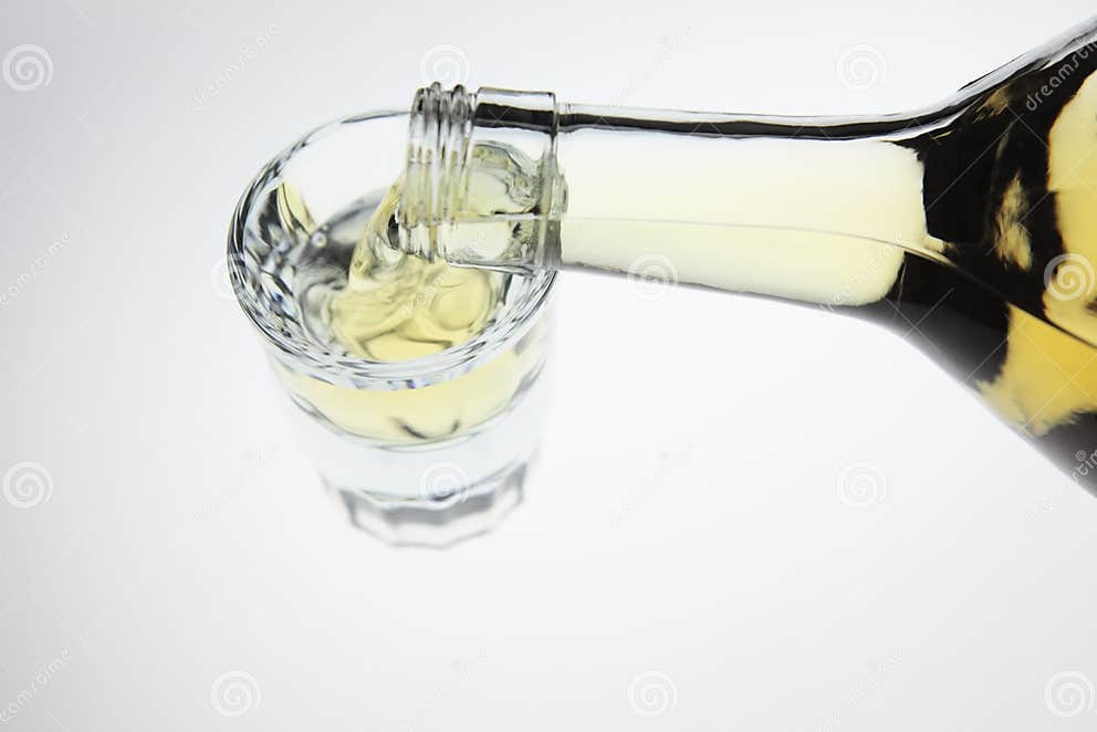 Pouring a shot of tequila stock image. Image of liquid - 7775929