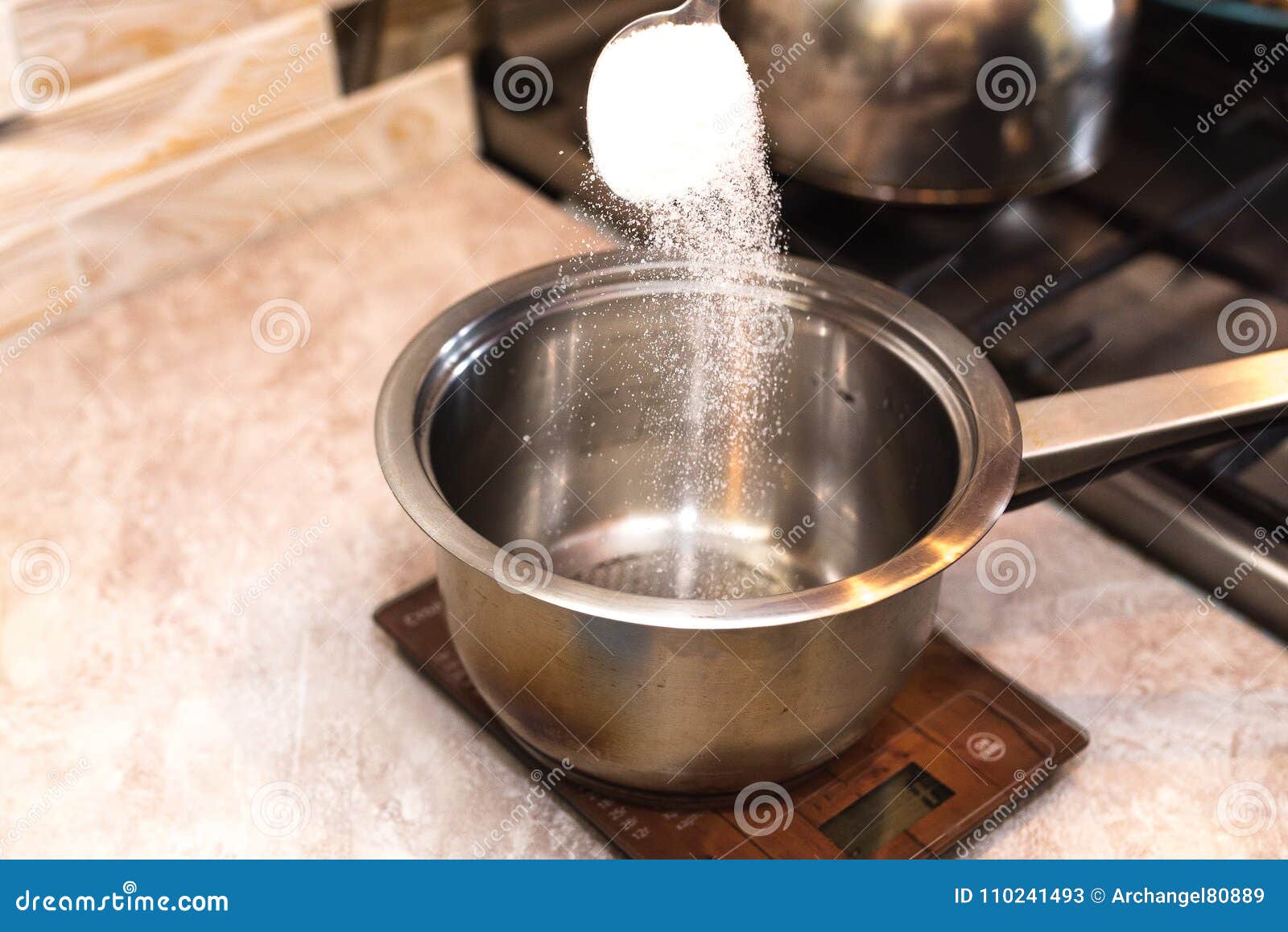 Pouring sugar into a pot stock image. Image of concept - 110241493