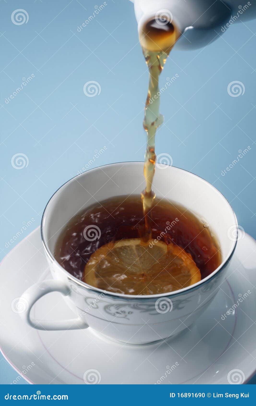 Pouring tea stock photo. Image of refreshments, british - 16891690