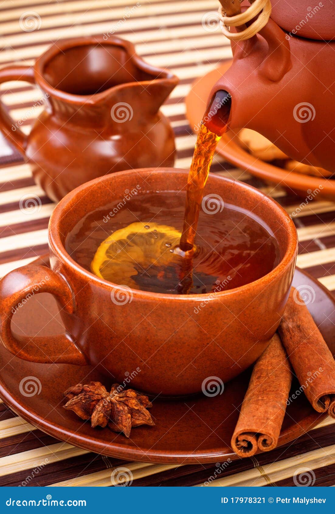 Pouring tea stock image. Image of beverage, saucer, brown - 17978321