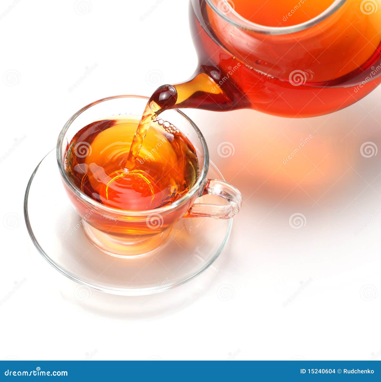 Pouring tea to a teacup stock photo. Image of teapot - 15240604