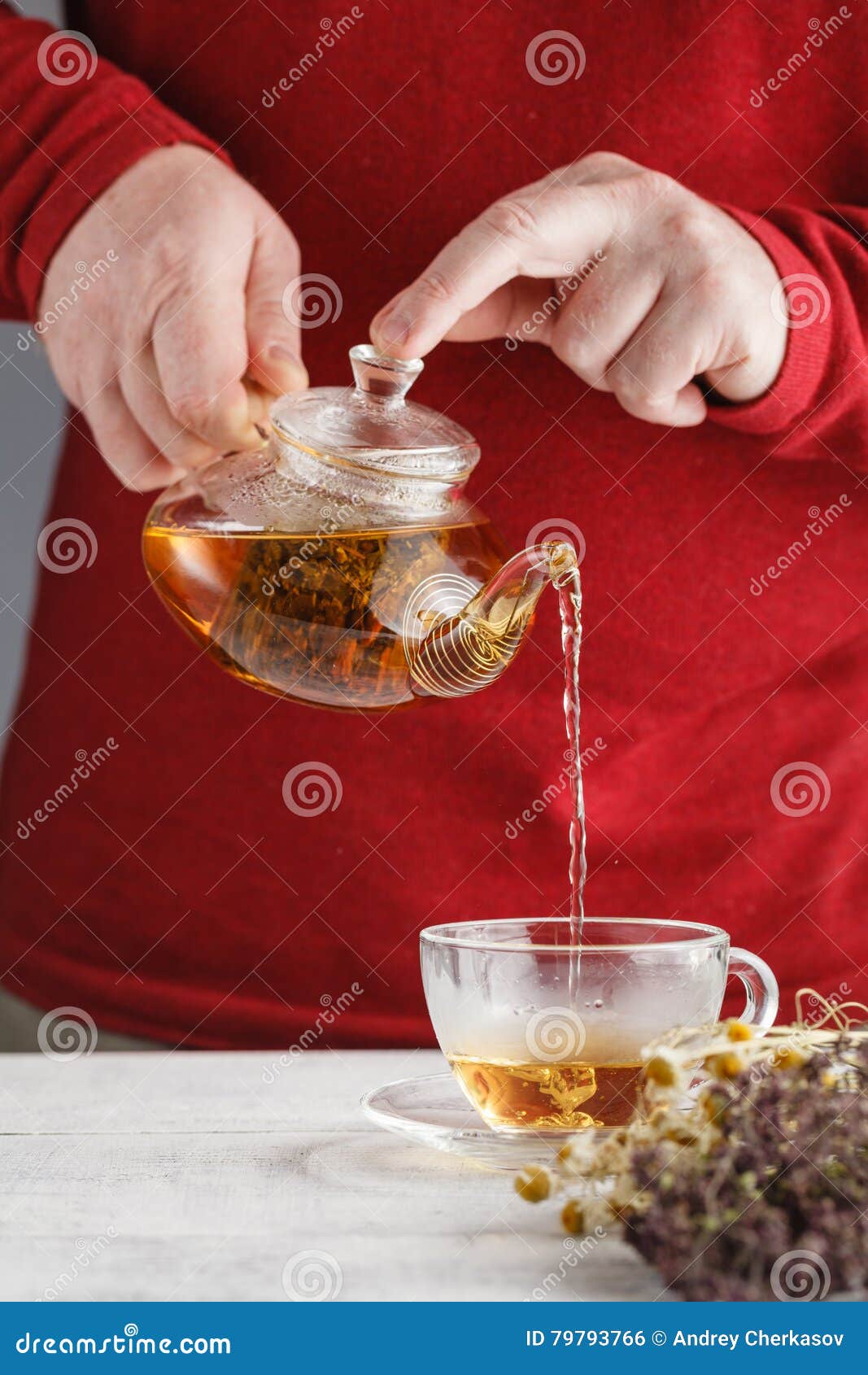Pouring tea to a teacup stock photo. Image of beverage - 79793766
