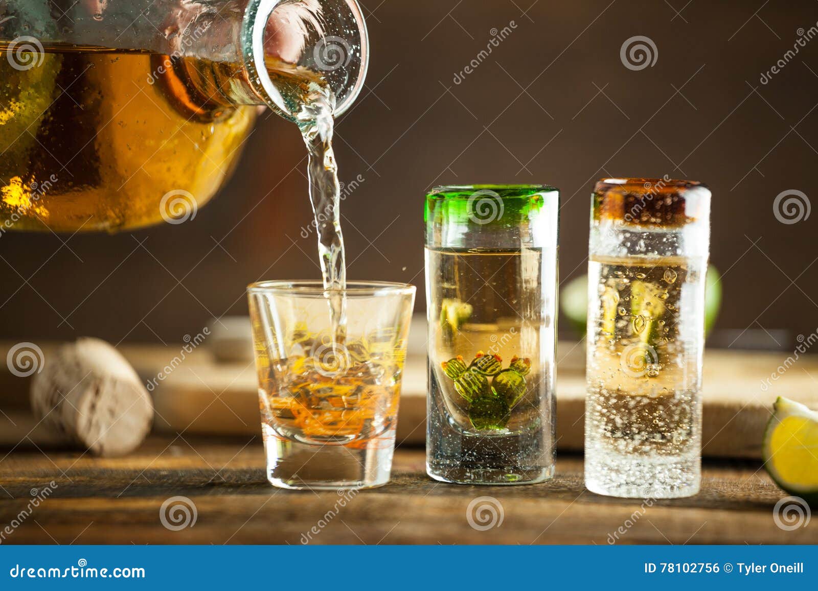 Pouring Tequila into Shot Glass. Selective Focus. Blurred Background ...