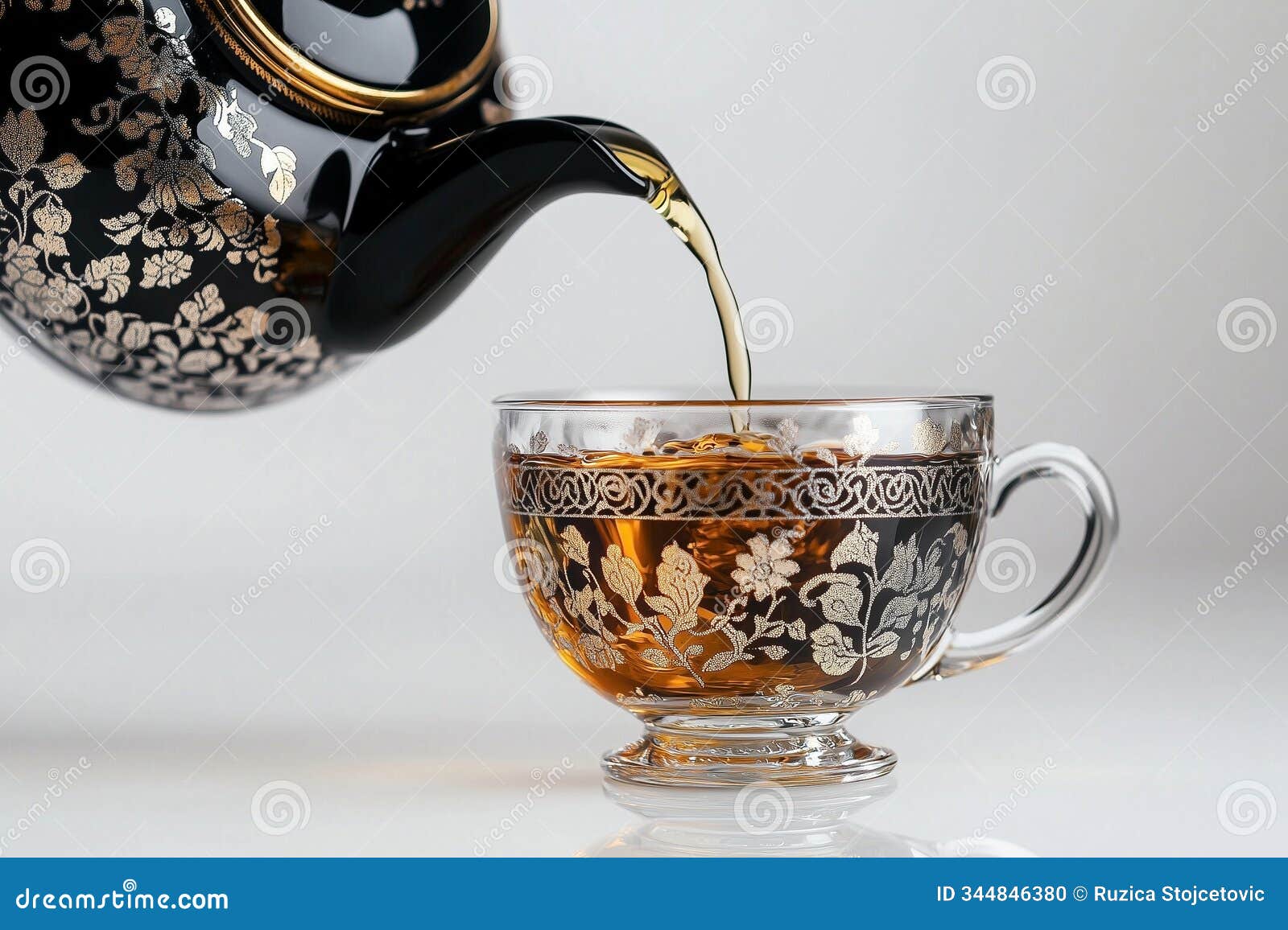 Pouring Traditional Turkish Tea from Pot into Glass with Traditional ...