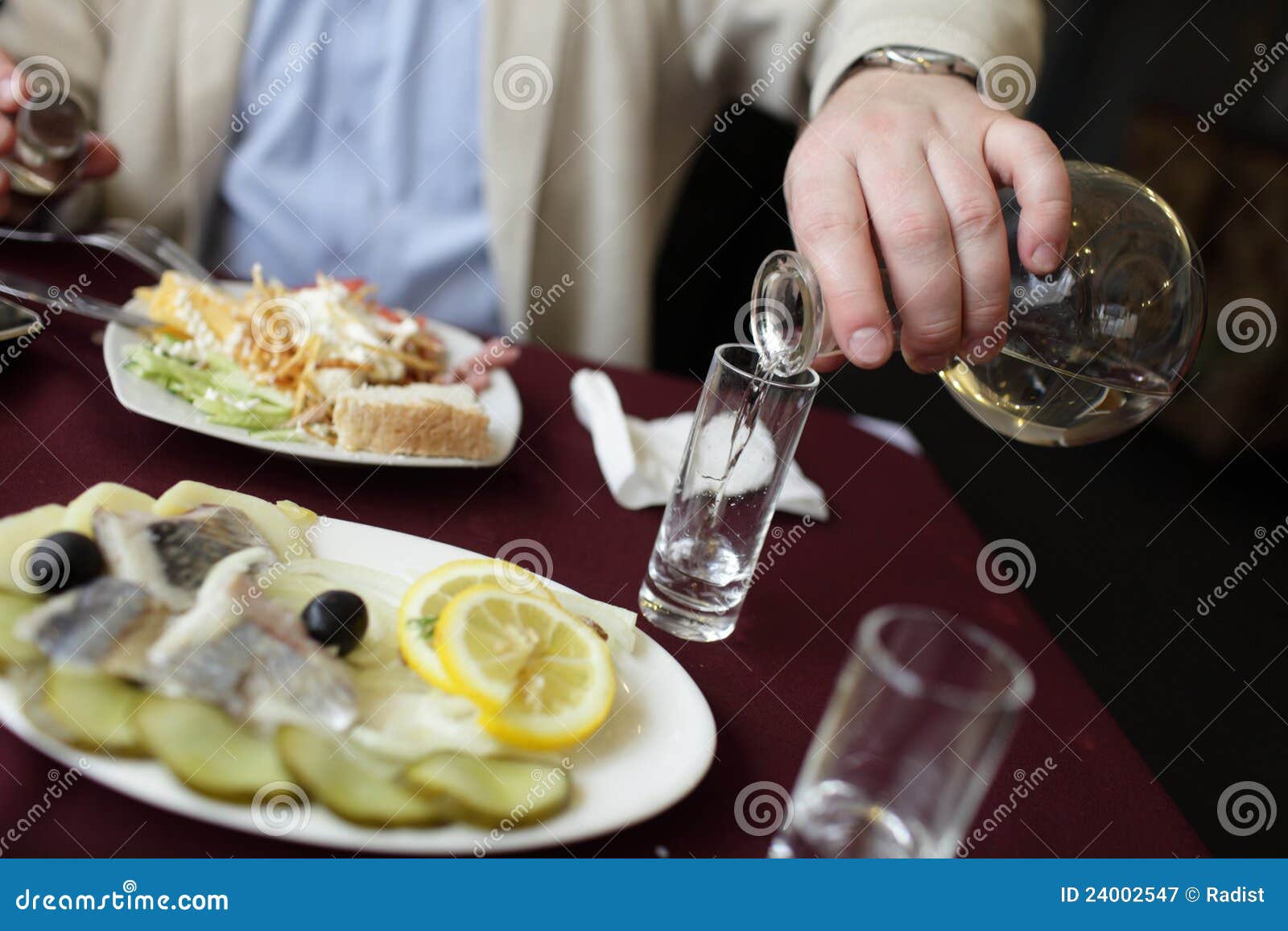 Pouring vodka into glass stock image. Image of beverage - 24002547