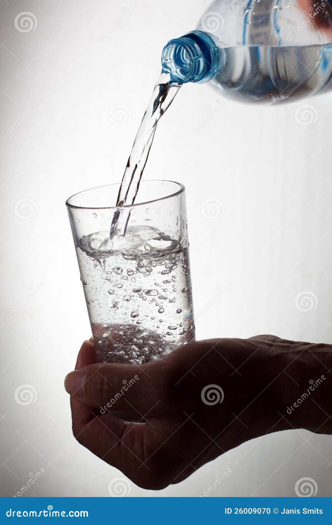 Pouring water. stock photo. Image of bottle, closeup - 26009070