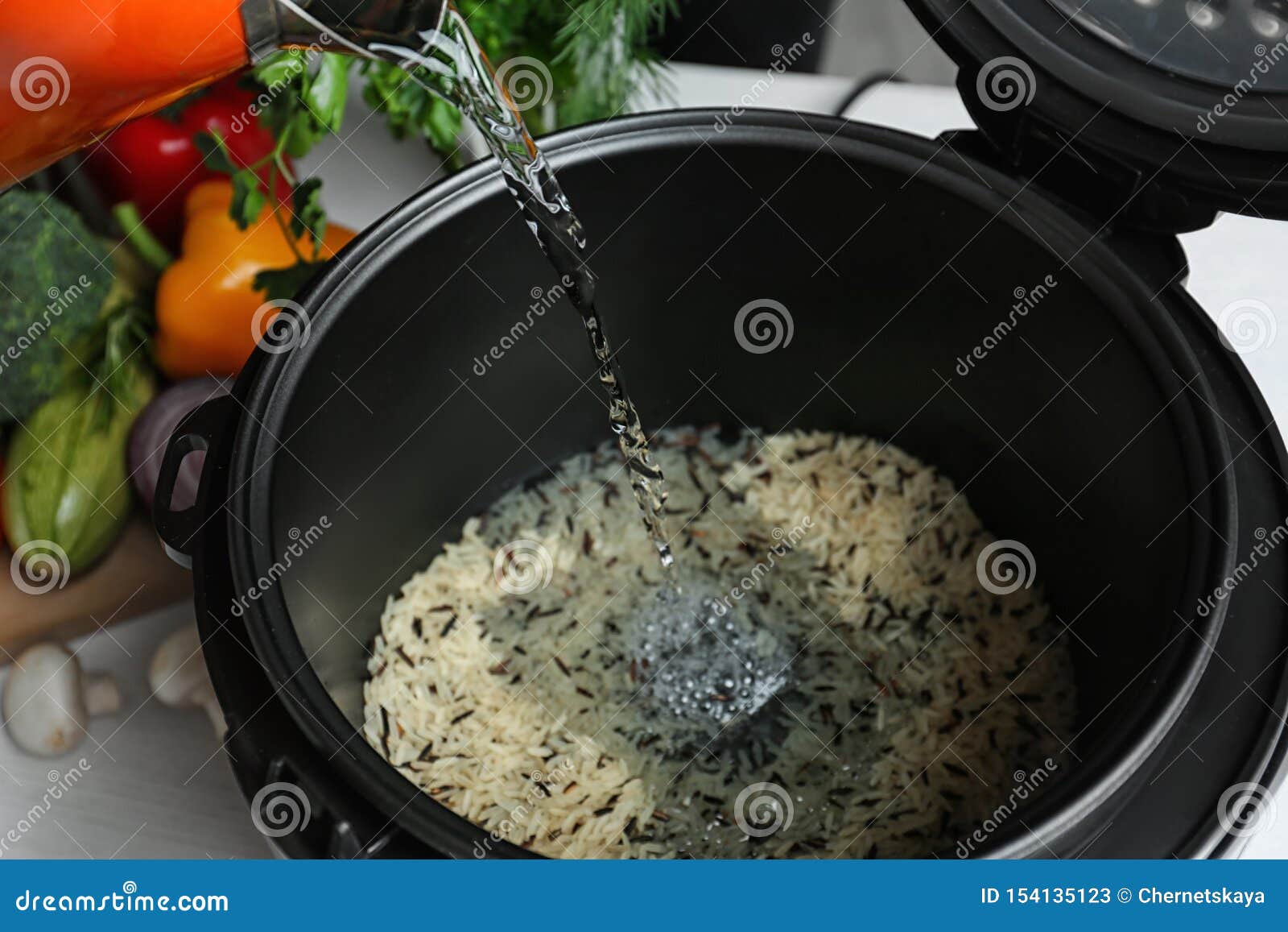 Pouring Water into Multi Cooker with Rice Stock Image - Image of ...