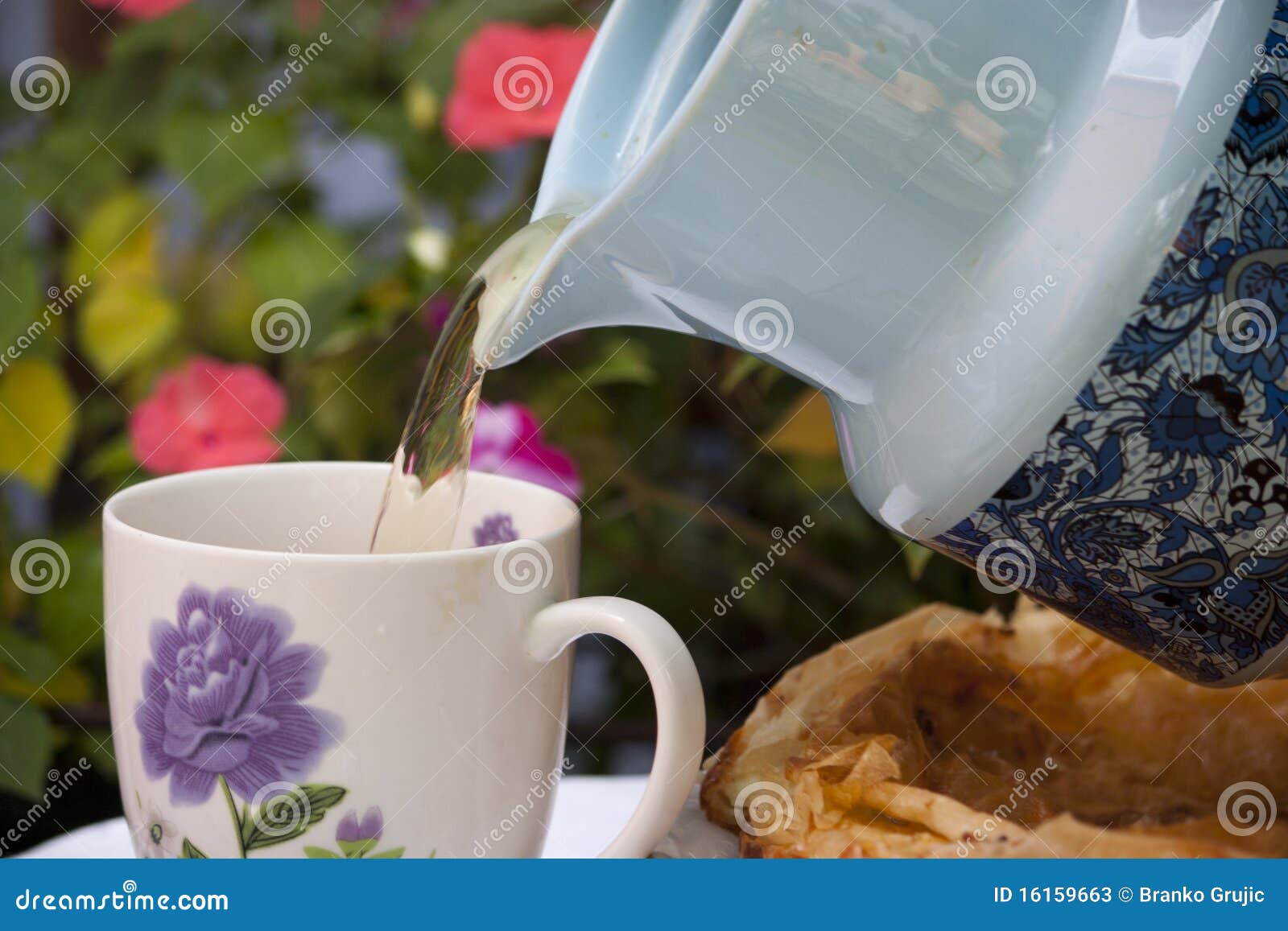 Pouring water into teacup stock image. Image of pouring - 16159663