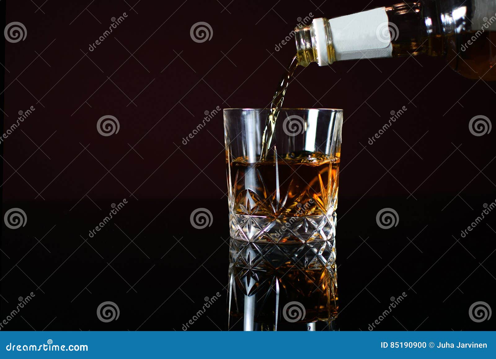 Pouring whiskey into glass stock photo. Image of aristocratic - 85190900