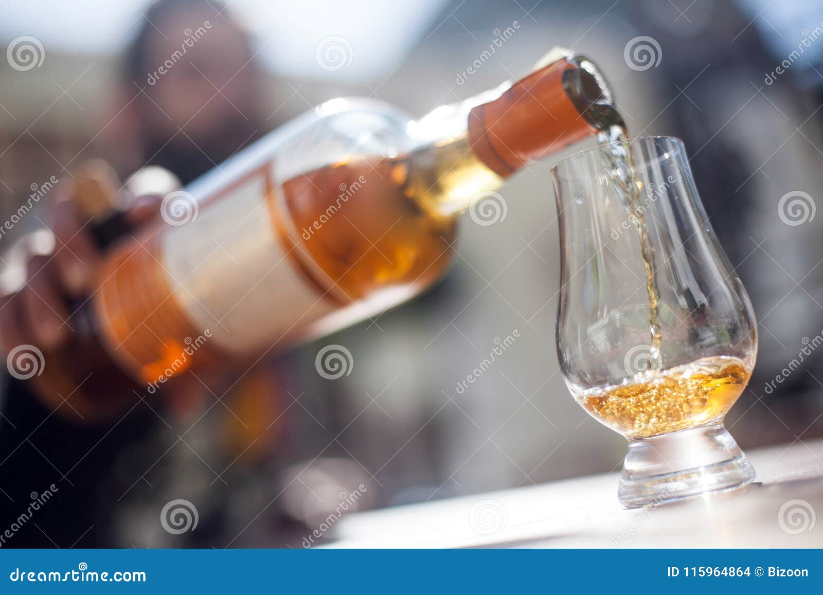 Pouring whisky in a glass stock photo. Image of closeup - 115964864