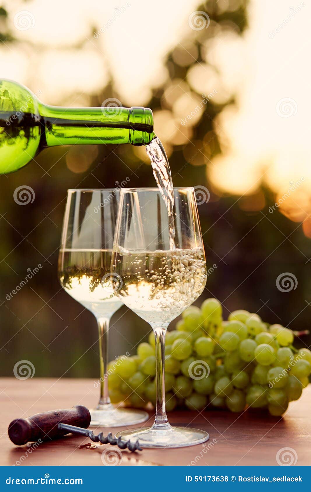 Pouring white wine stock photo. Image of alcohol, close - 59173638