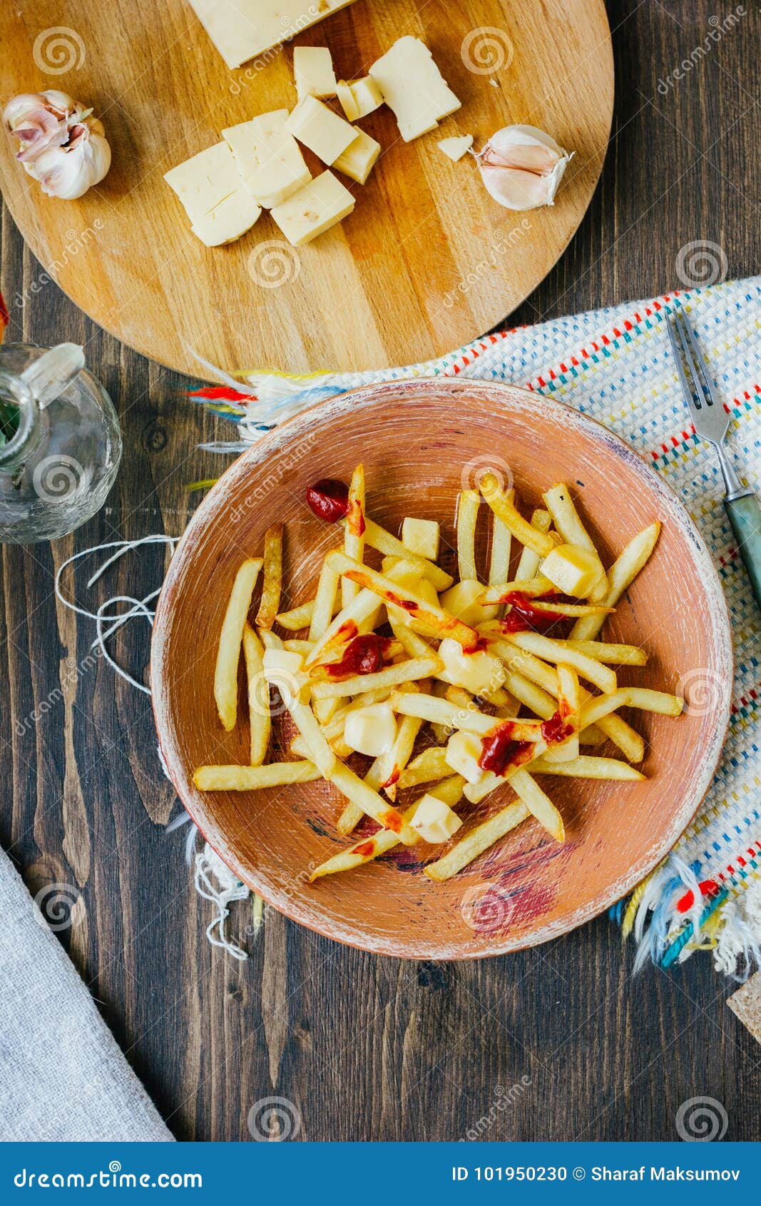 Poutine Fries on Black Surface. Canadian Dish with Potatoes, Cheese and ...