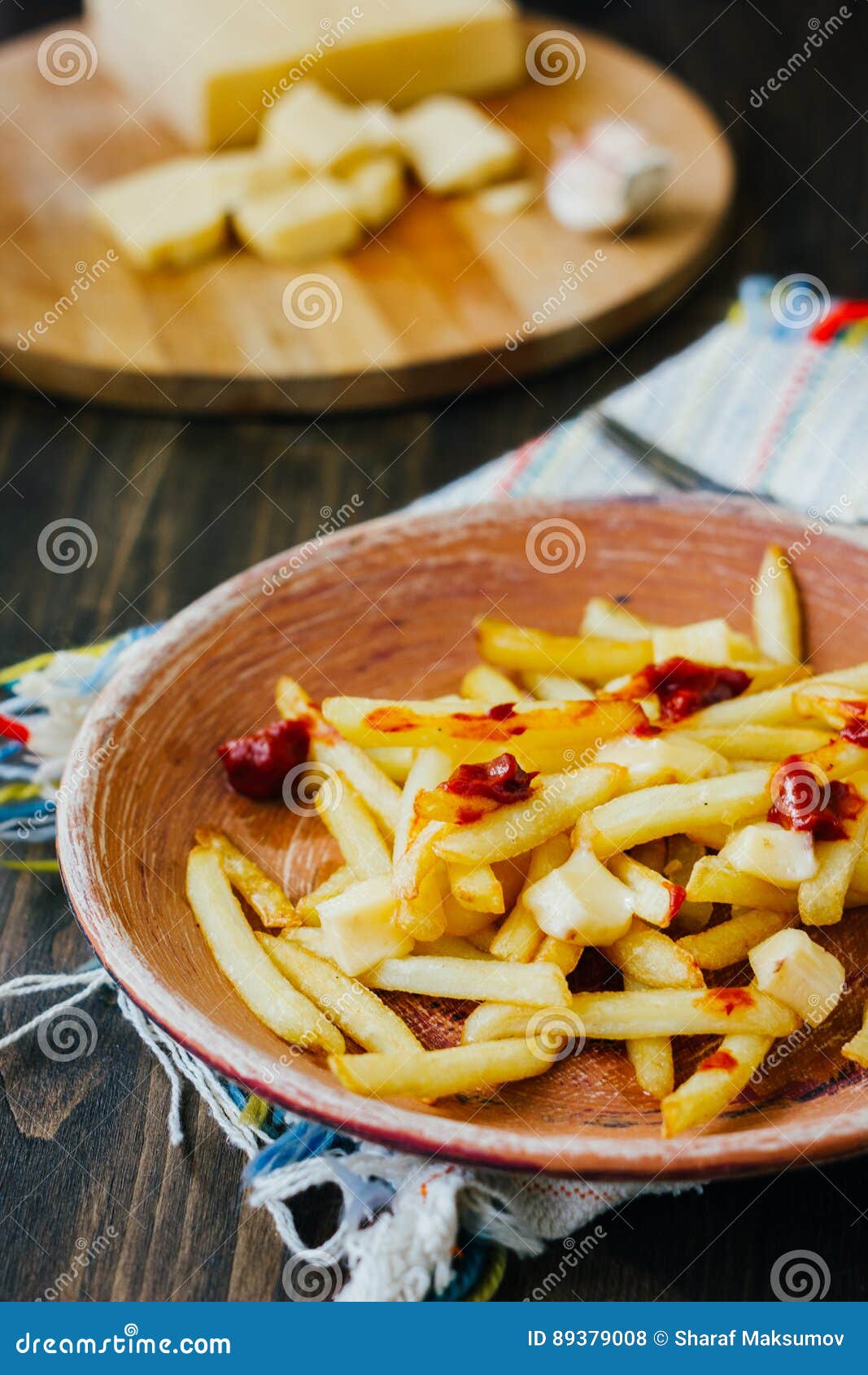 Poutine Fries on Black Surface. Canadian Dish with Potatoes, Cheese and ...