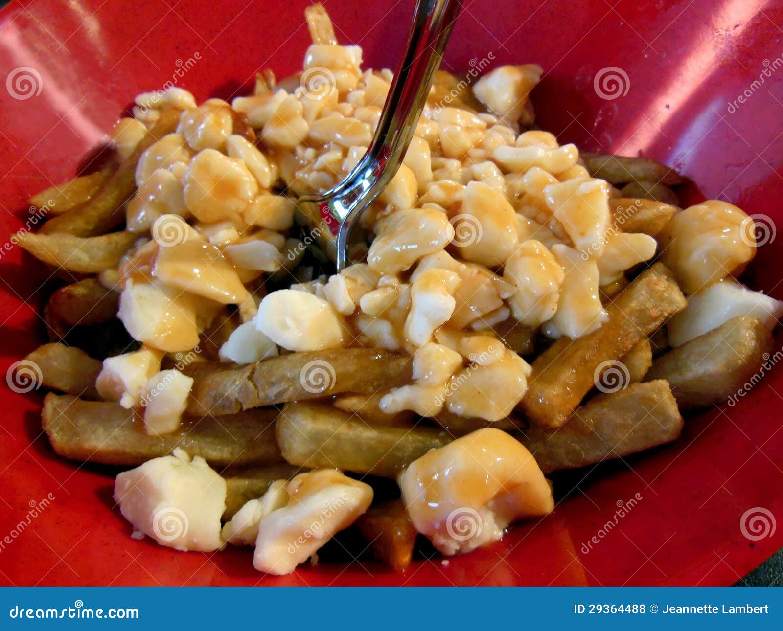 Poutine in red bowl stock photo. Image of poutine, meal - 29364488