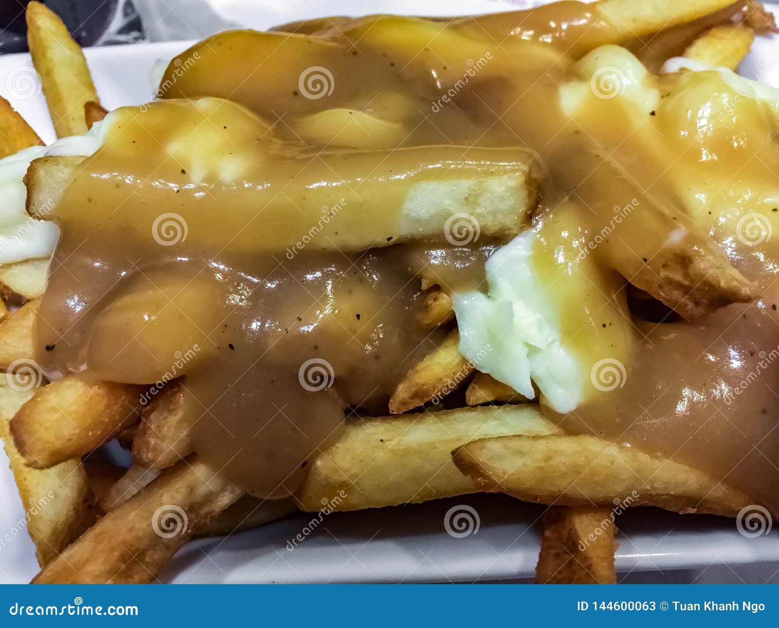 Poutine Traditional Canadian Meal With Fries, Curd Cheese And Sauce ...