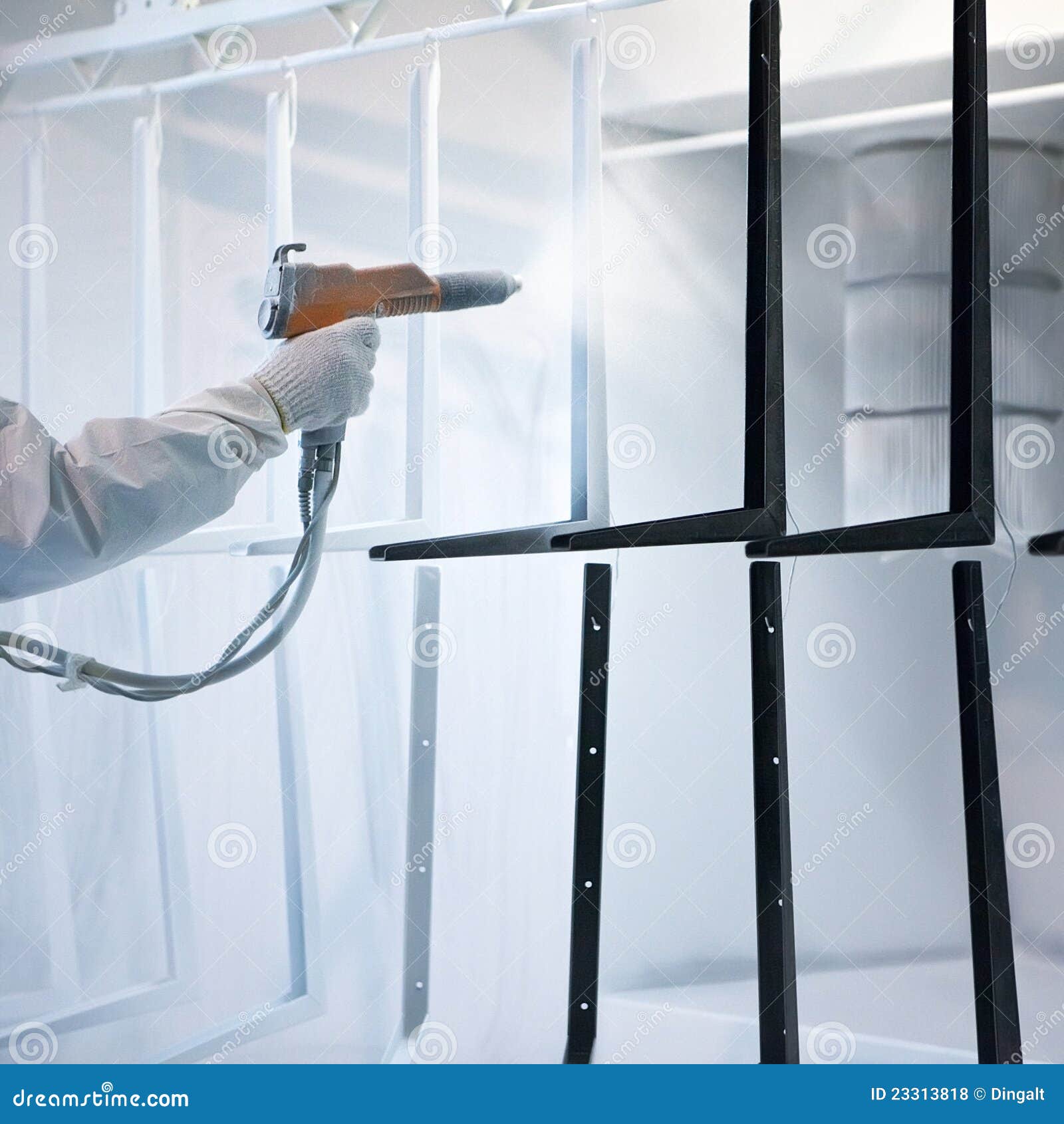 Powder Coating Of Metal Parts. A Woman In A Protective Suit Sprays ...