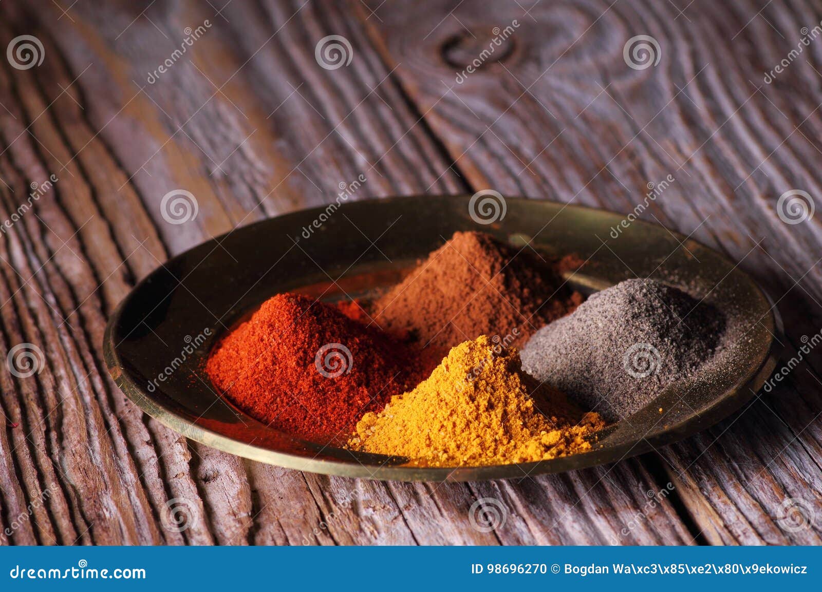 Powder spices on a plate stock photo. Image of fresh - 98696270