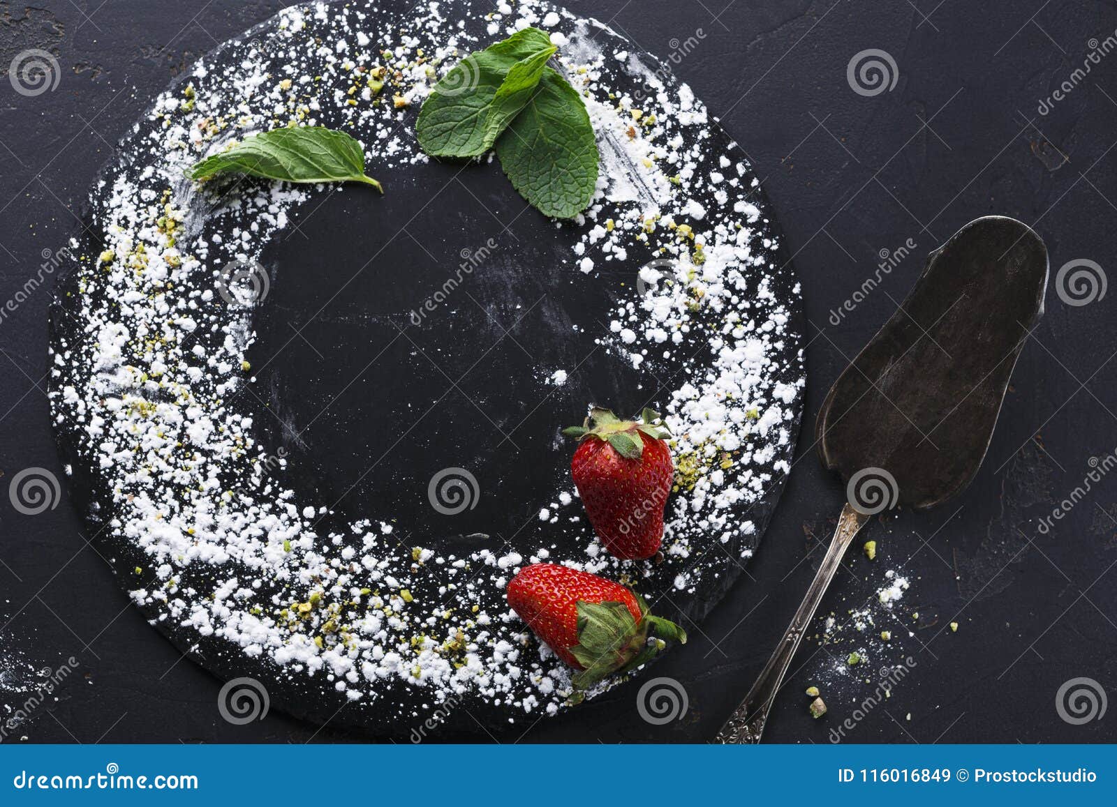 Powdered Sugar Frame and Cake Spatula on Black Background Stock Image ...