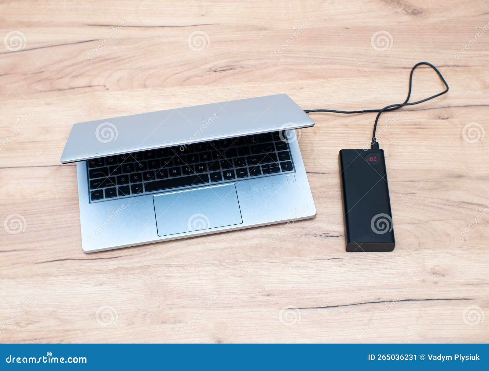 Power Bank with Usb-c Cable is Charging Laptop . Modern, Information ...