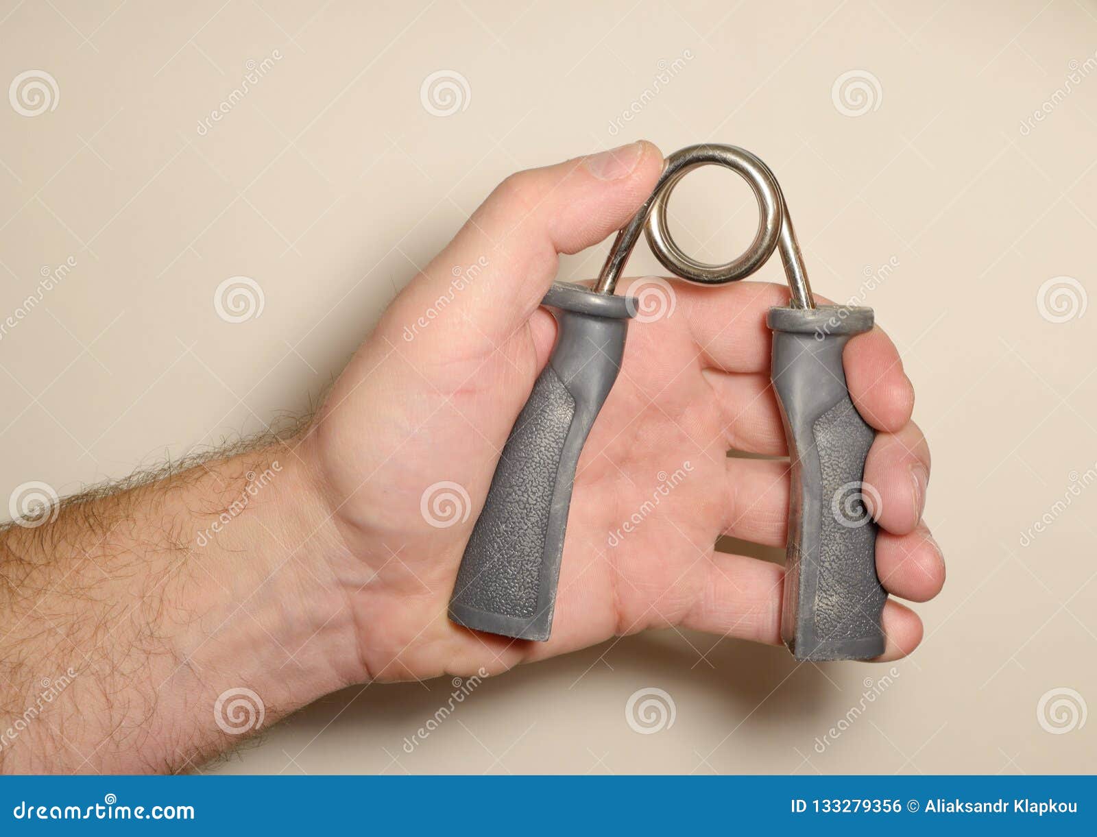 Power expander in hand stock photo. Image of active - 133279356