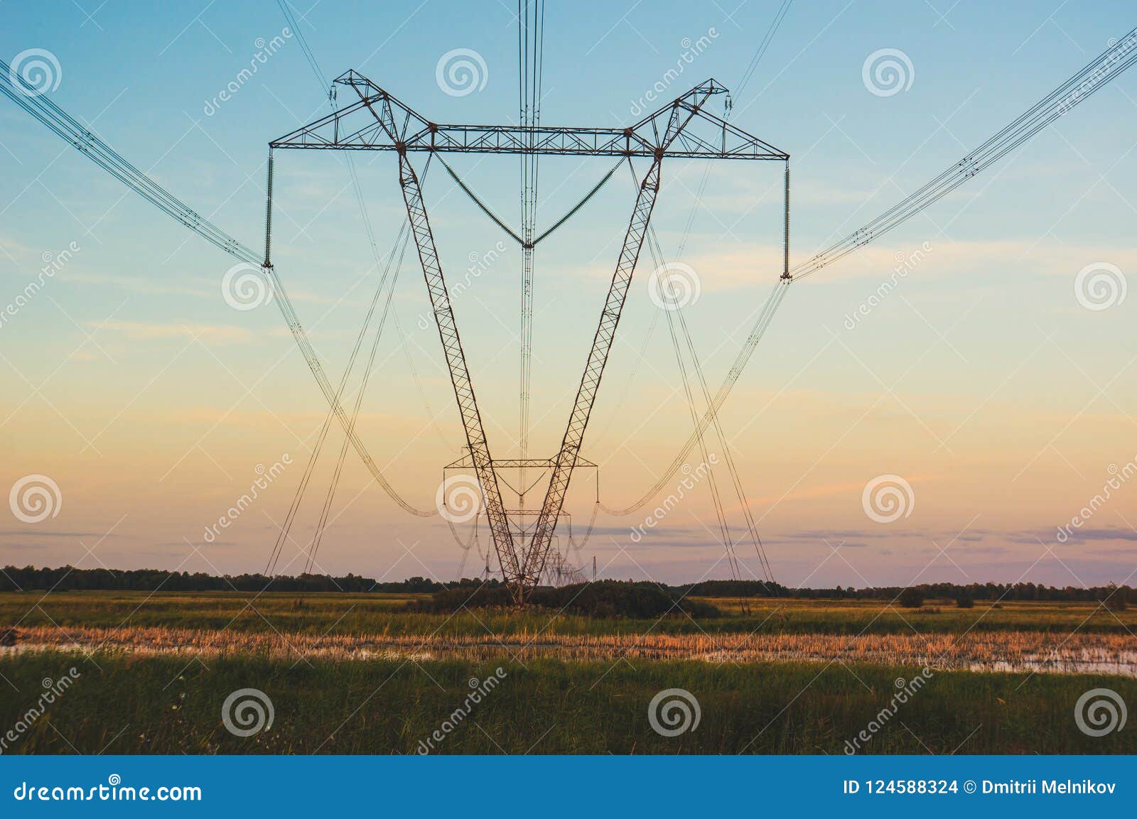 Power Line in a Field on the Background of Beautiful Sunset Stock Photo ...