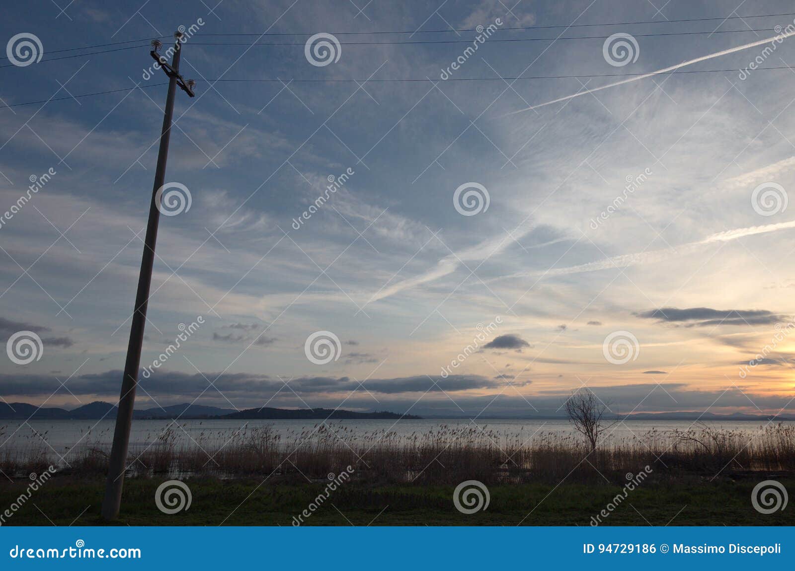 Power line at the lake stock photo. Image of cielo, clouds - 94729186