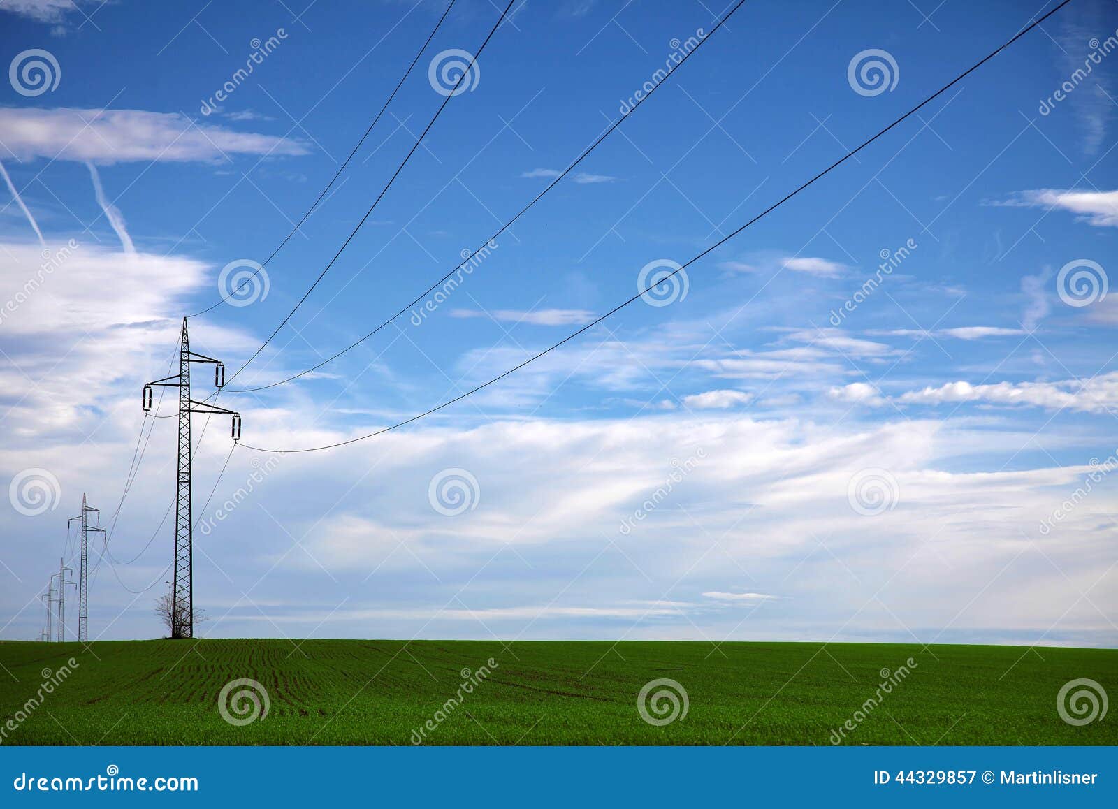 Power Line in the Middle of a Green Field with Blue Sky Stock Image ...