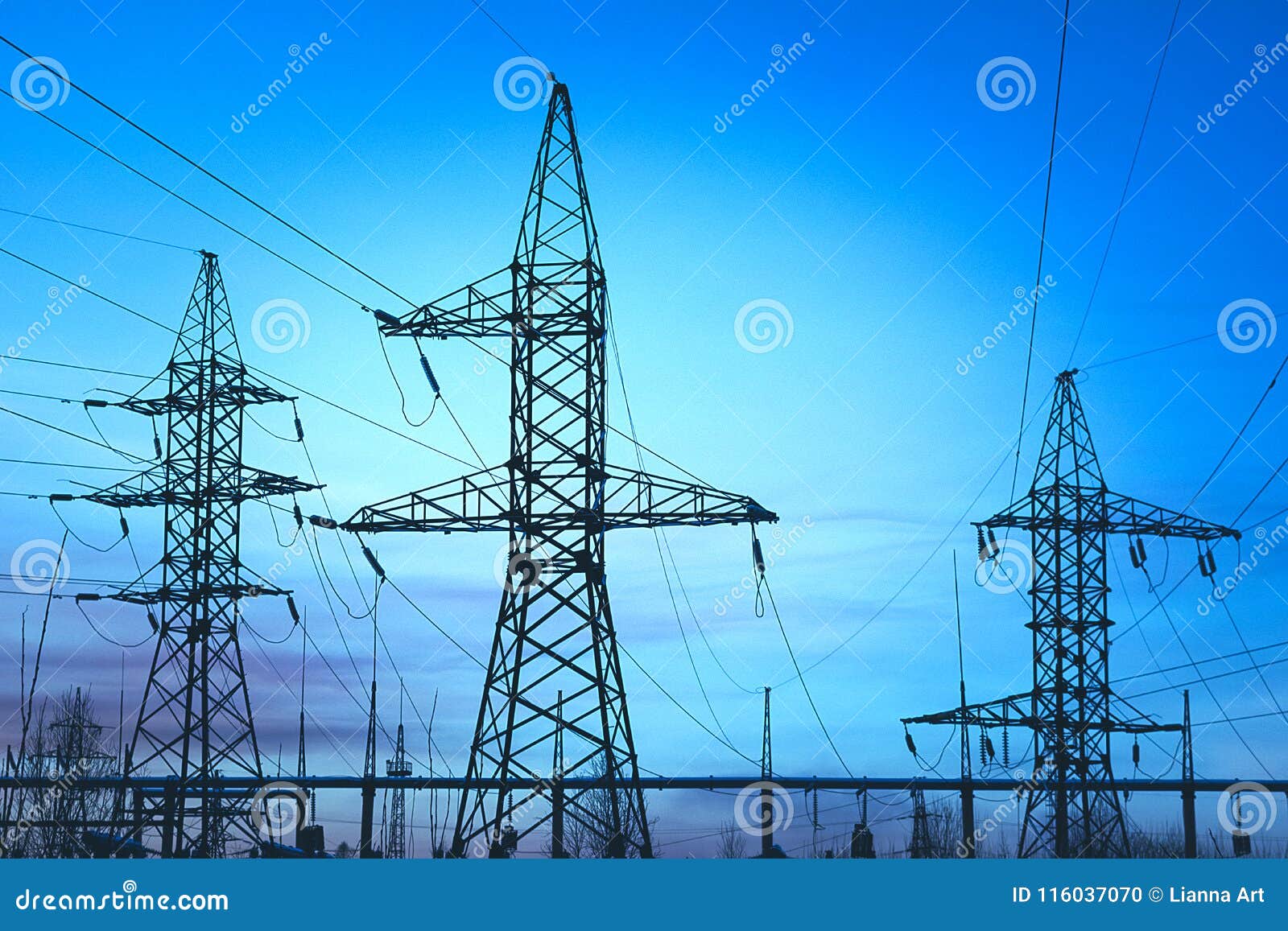 Power Line Towers Against the Background of the Blue Sky Stock Photo ...