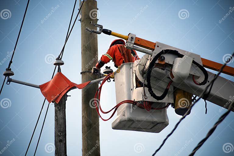 Electricity Line Worker Repairing Power Lines Using Aerial Platform ...