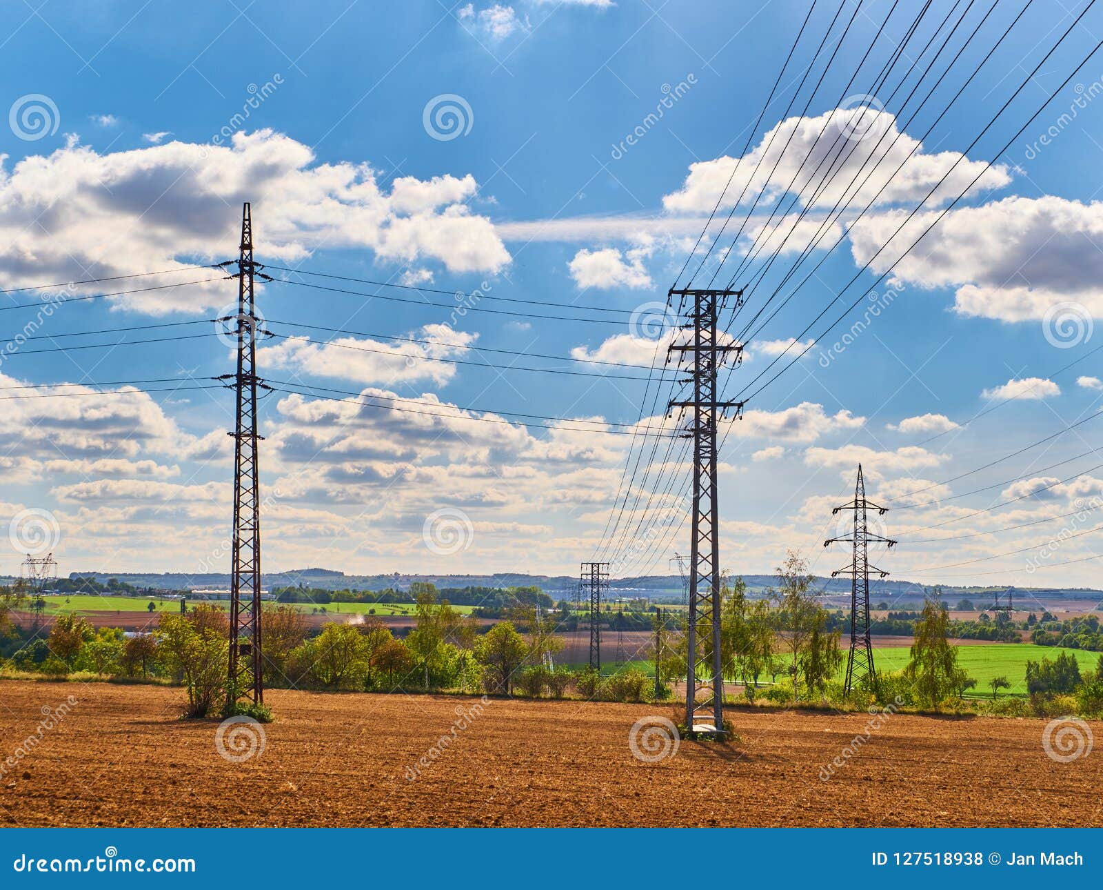 Power lines in fields stock photo. Image of electric - 127518938