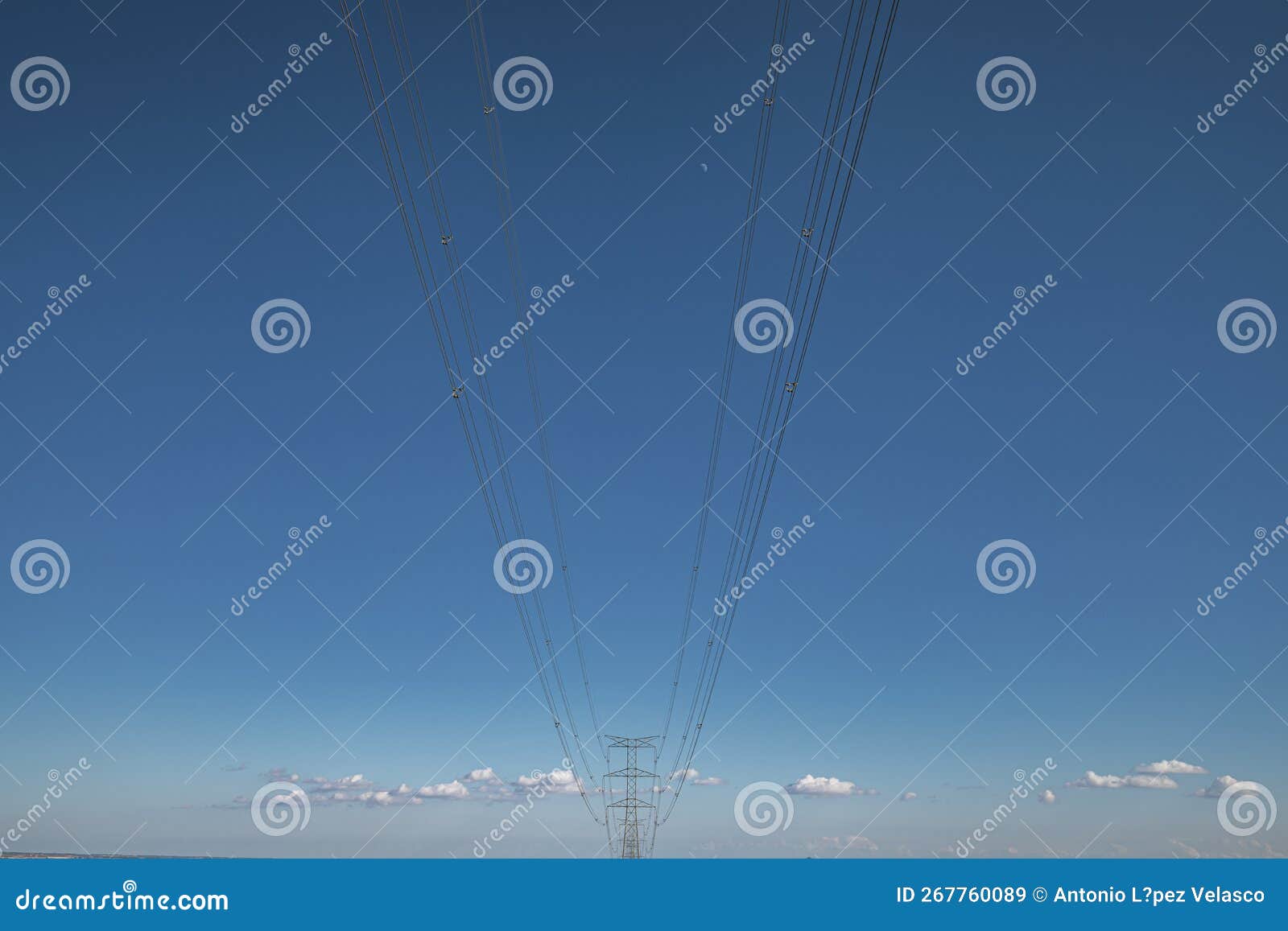 Power Lines with Electricity Tower in the Background on Intense Blue ...