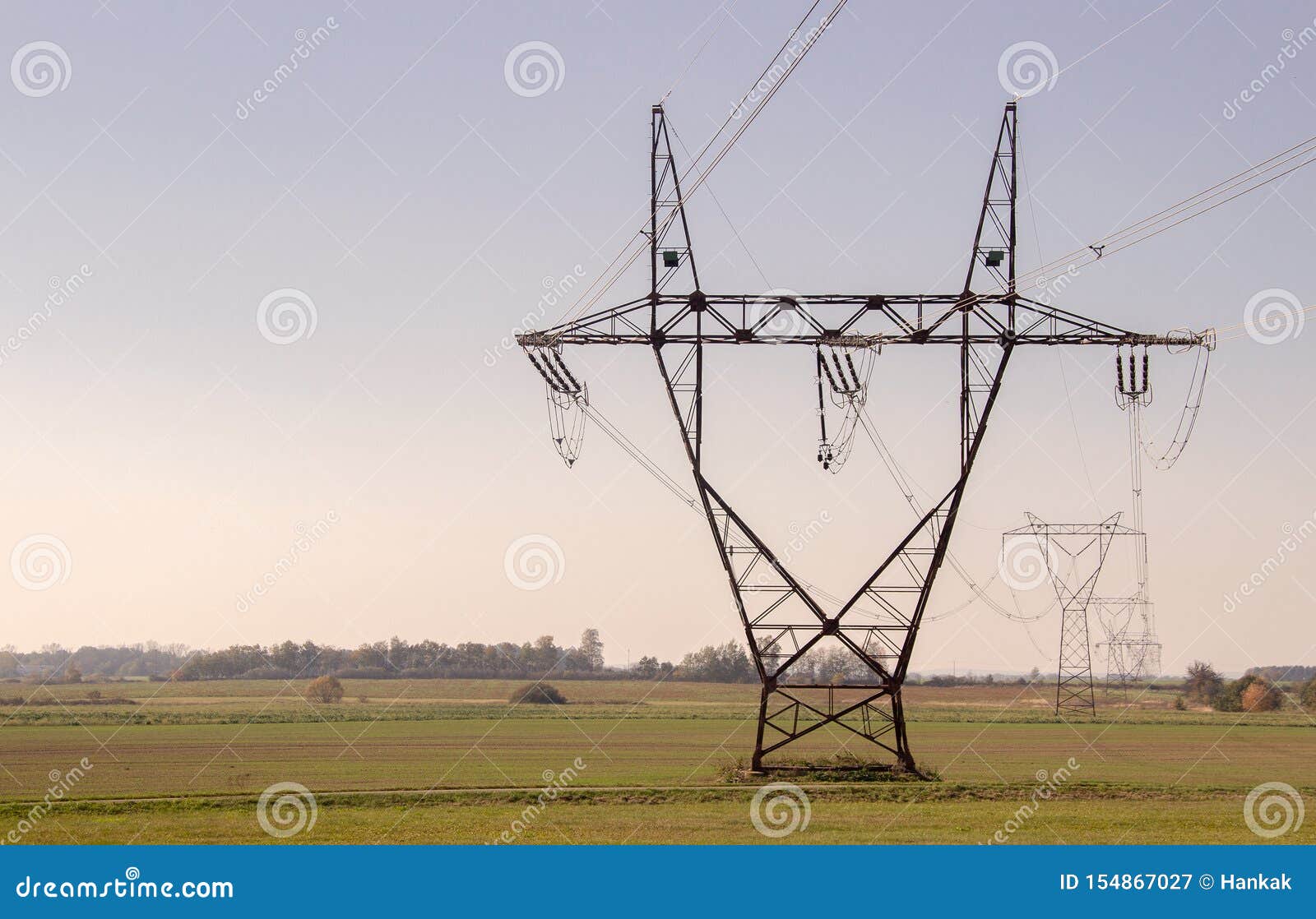 Power lines on field stock image. Image of pylon, pole - 154867027