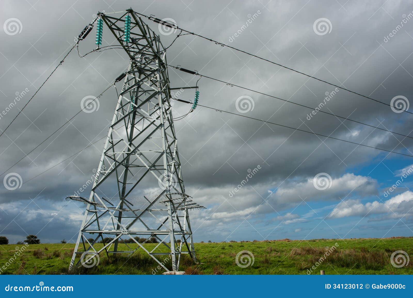 Power lines in a field stock photo. Image of industry - 34123012