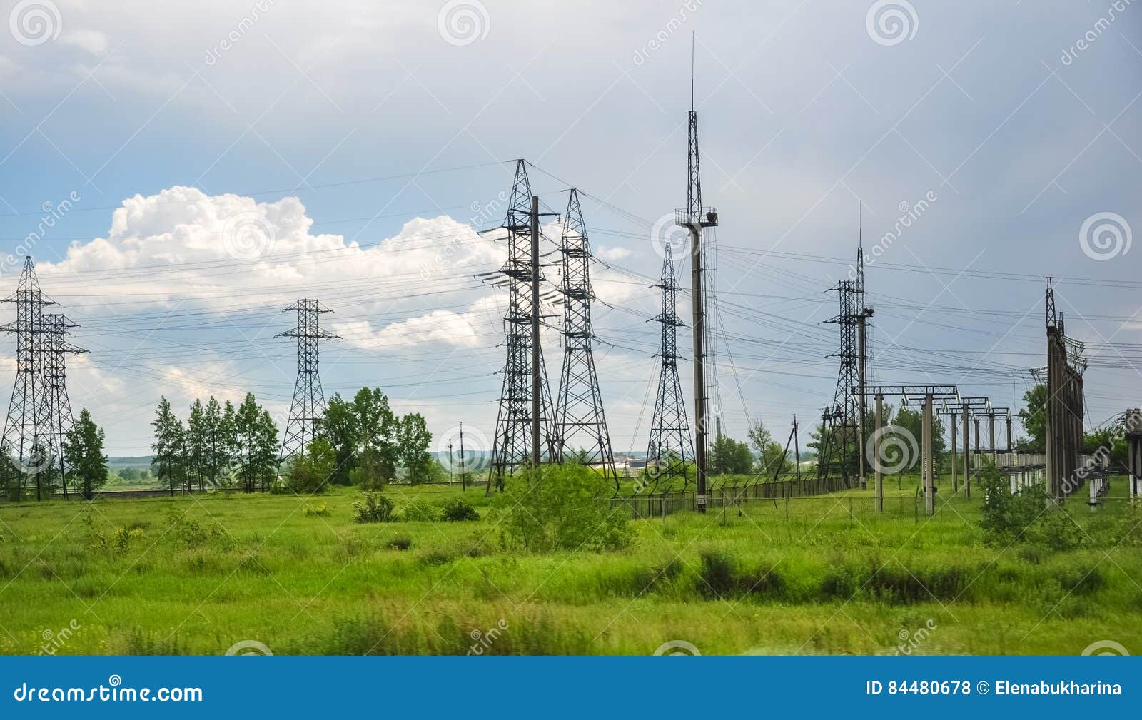 Power lines in the field stock photo. Image of voltage - 84480678