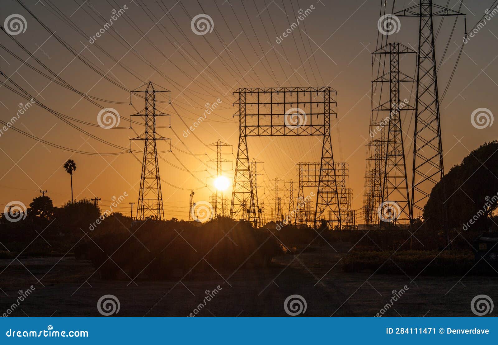 Power Lines with Towers in Silhouette at Sunset Stock Image - Image of ...