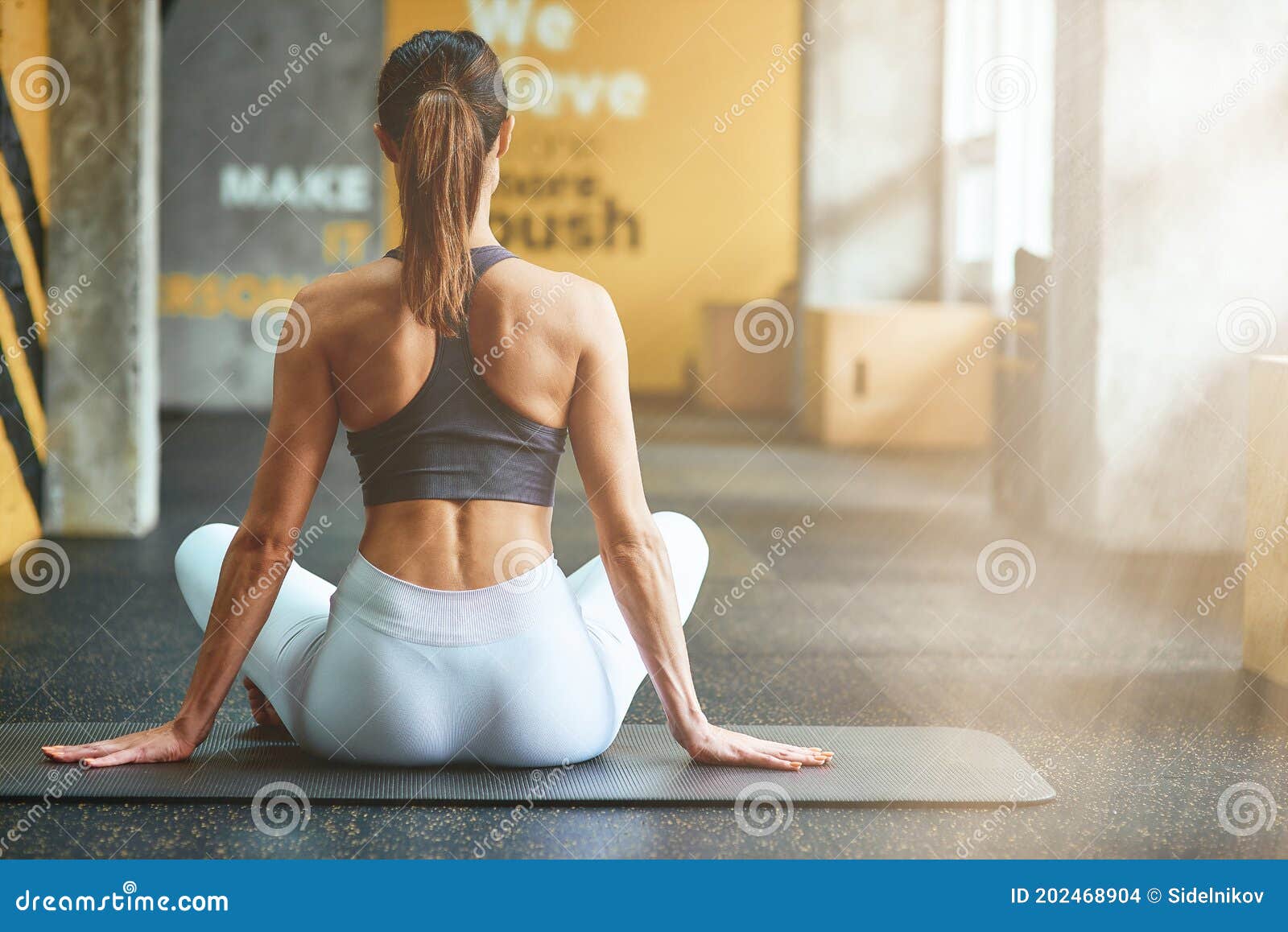 Power Of Meditation Rear View Of Woman In Sportswear Sitting On Yoga